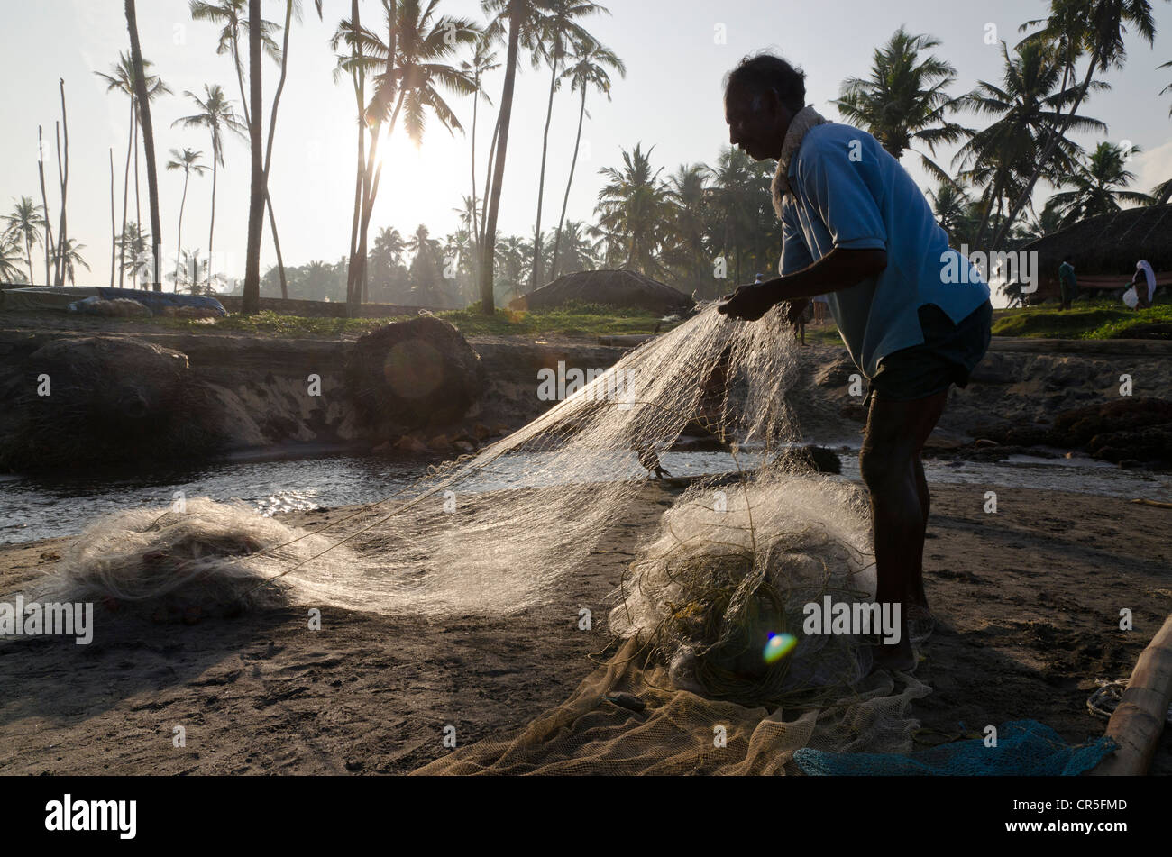 Fishermen fishing the traditional way, in a small village at the coast ...