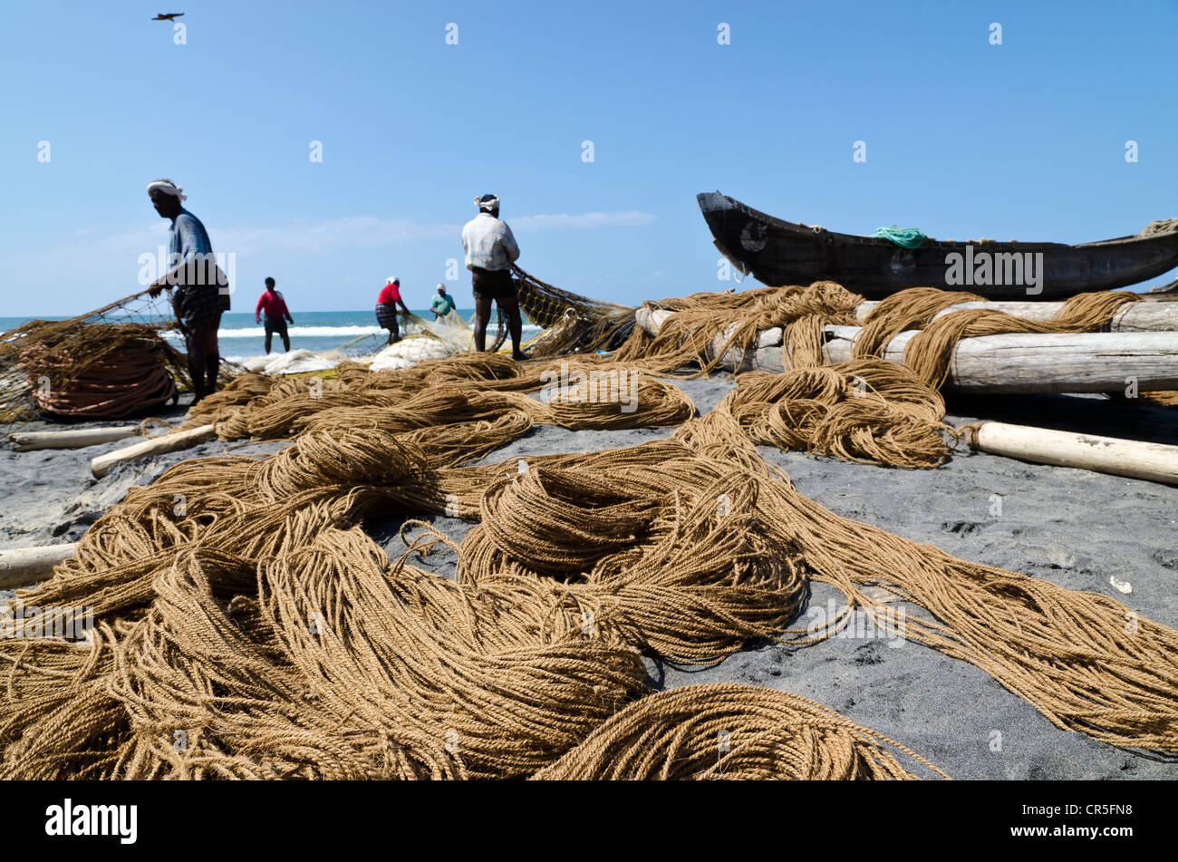 Fishermen fishing the traditional way, in a small village at the coast ...