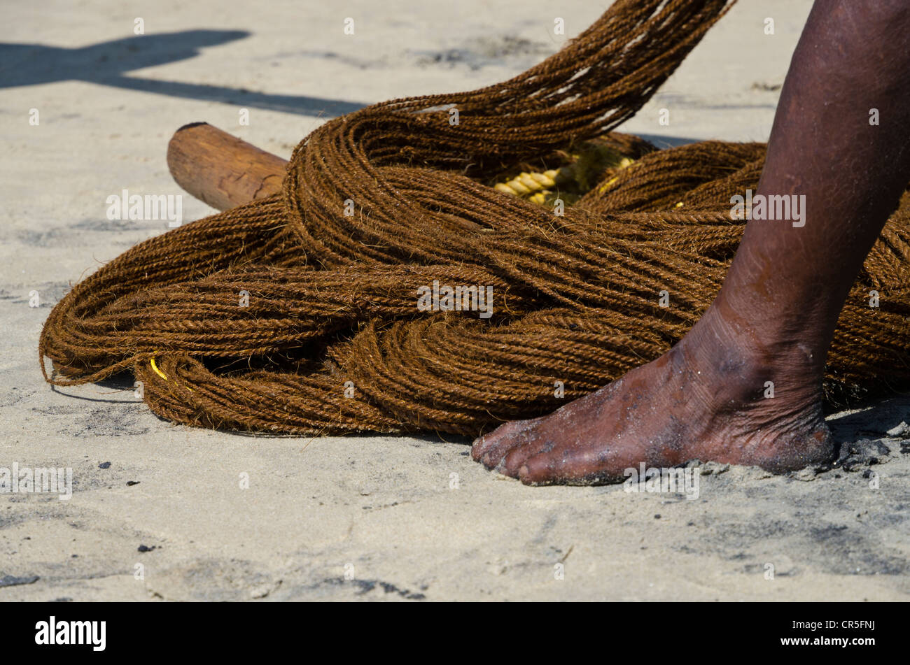 Fisherman fishing the traditional way, in a small village at the coast ...
