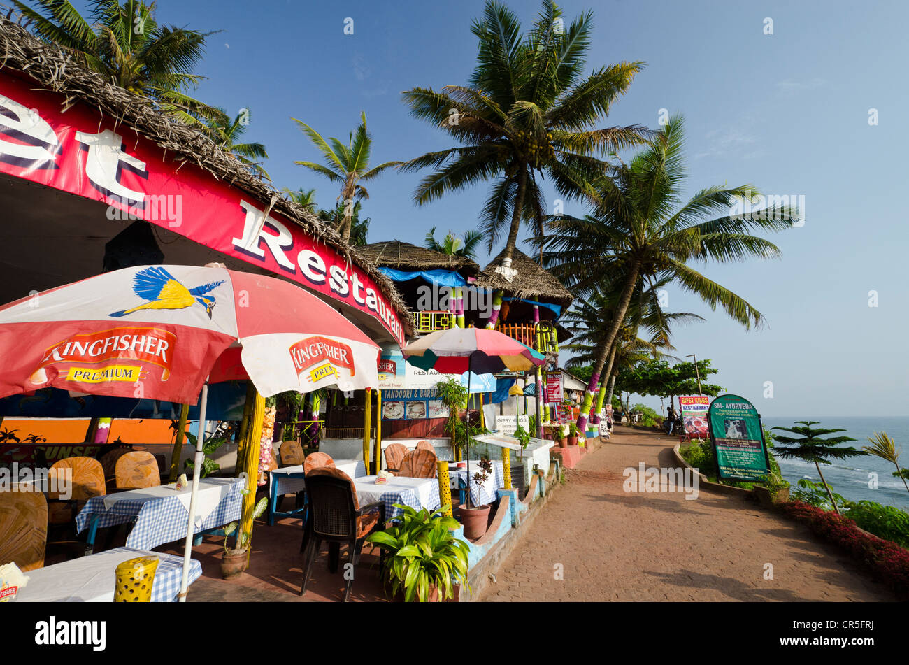 Shops and guesthouses for western tourists, above the beach of Varkala ...