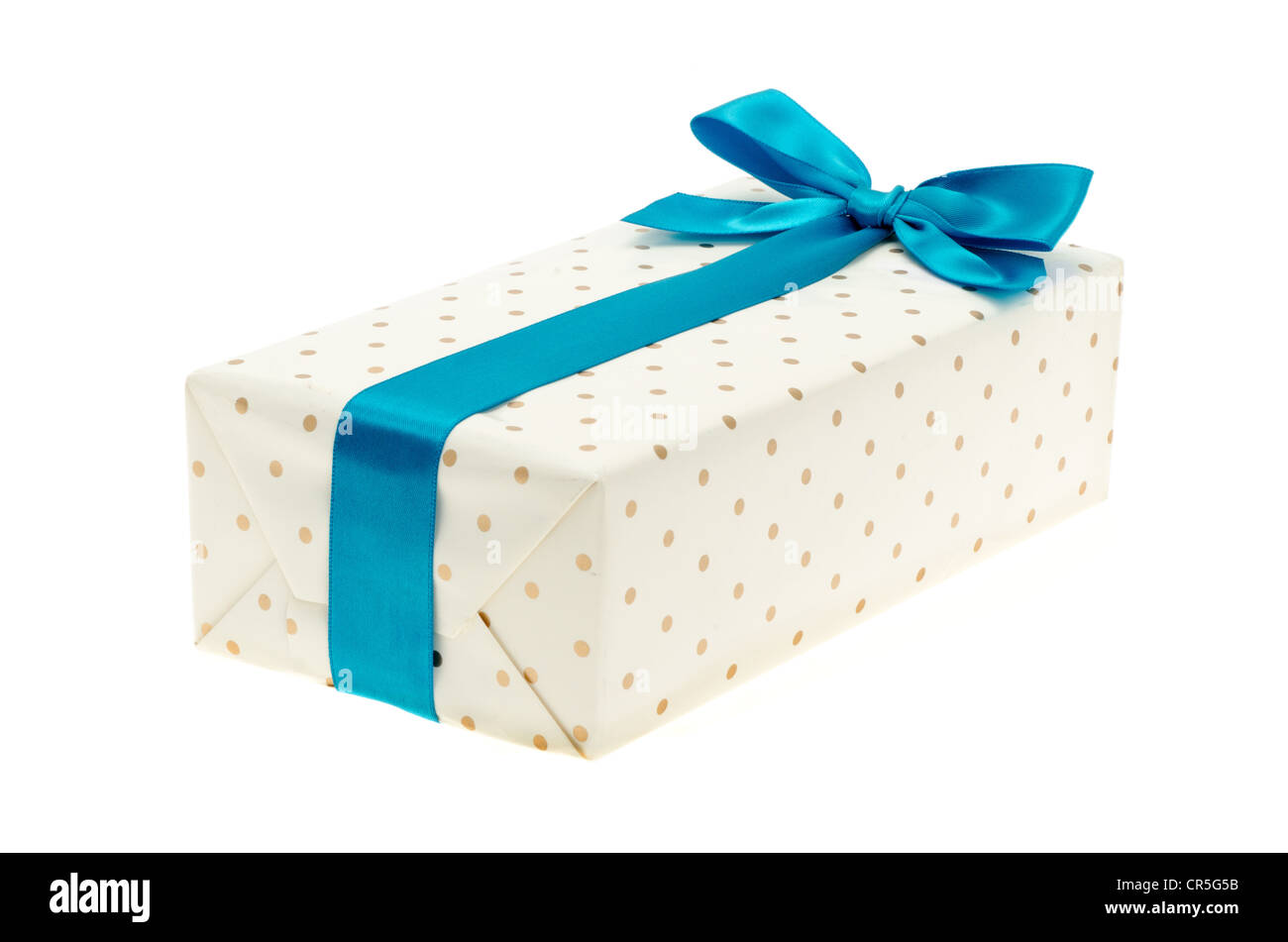 Gift wrapped box with a blue ribbon and bow - shot from the side in the ...