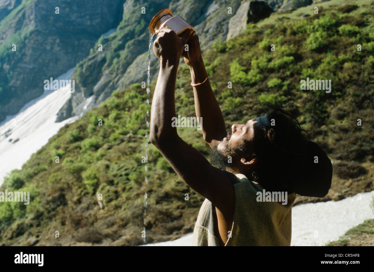 Shiva sadhu practicing rituals next to his cave high above Badrinath ...