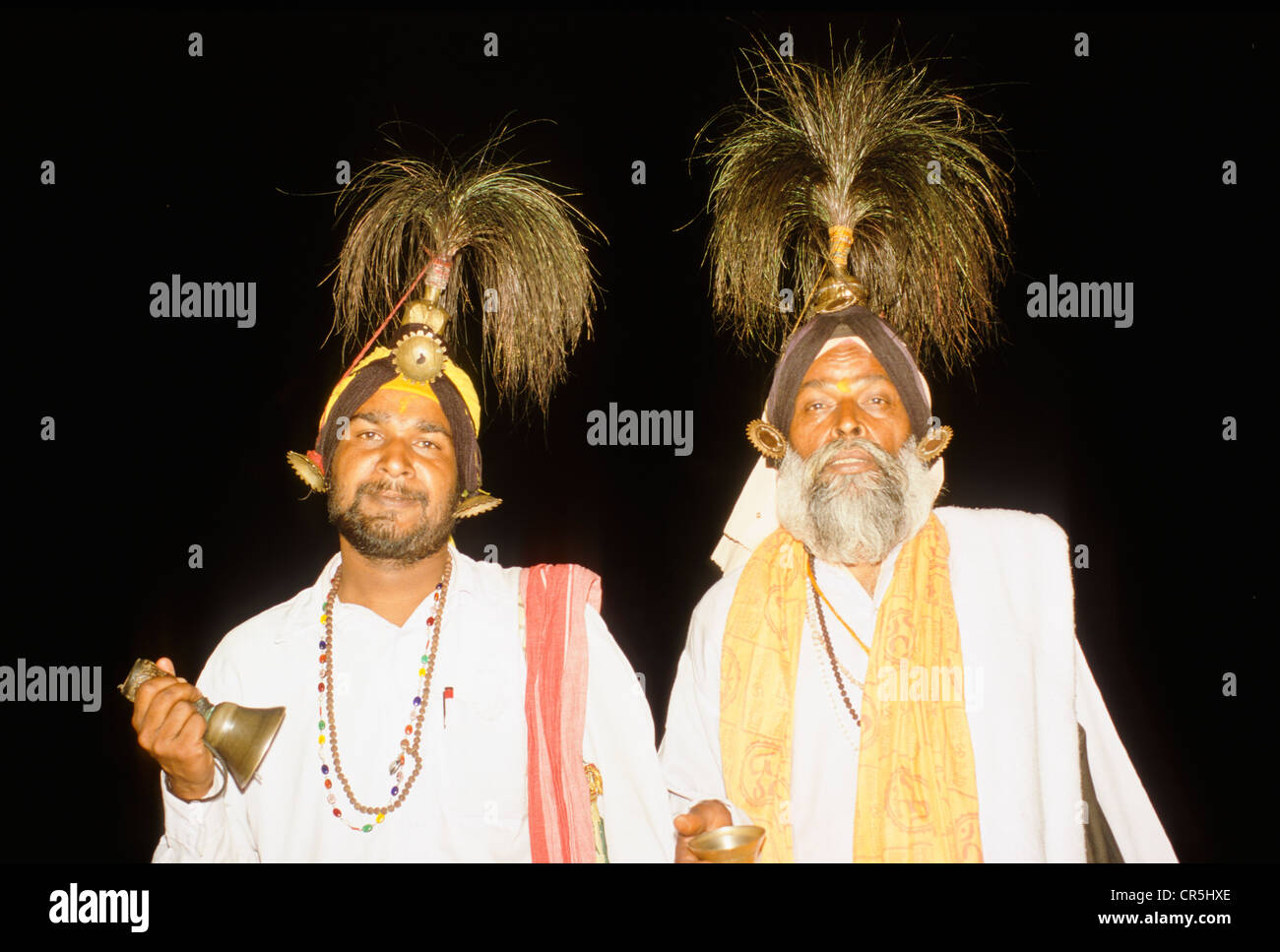 Two Jangam Sadhus, with decorative dresses, chanting Shiva songs ...