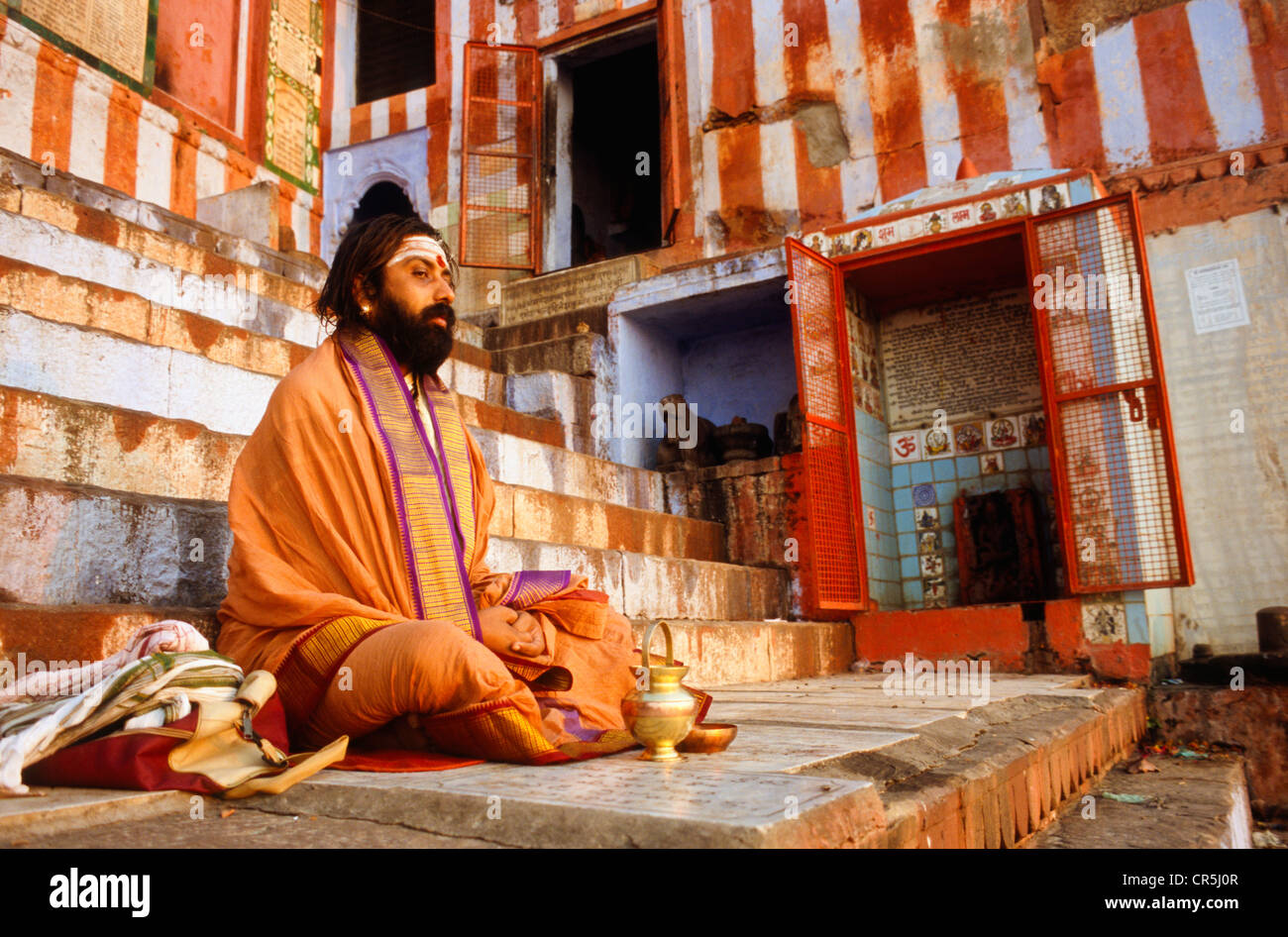 Sadhu meditating at the ghats of Varanasi, Uttar Pradesh, India, Asia ...