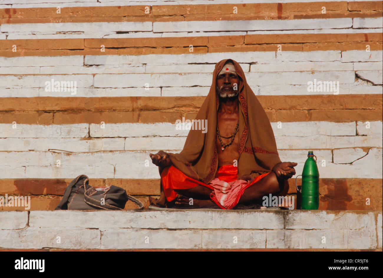 Sadhu meditating at the ghats of Varanasi, Uttar Pradesh, India, Asia ...