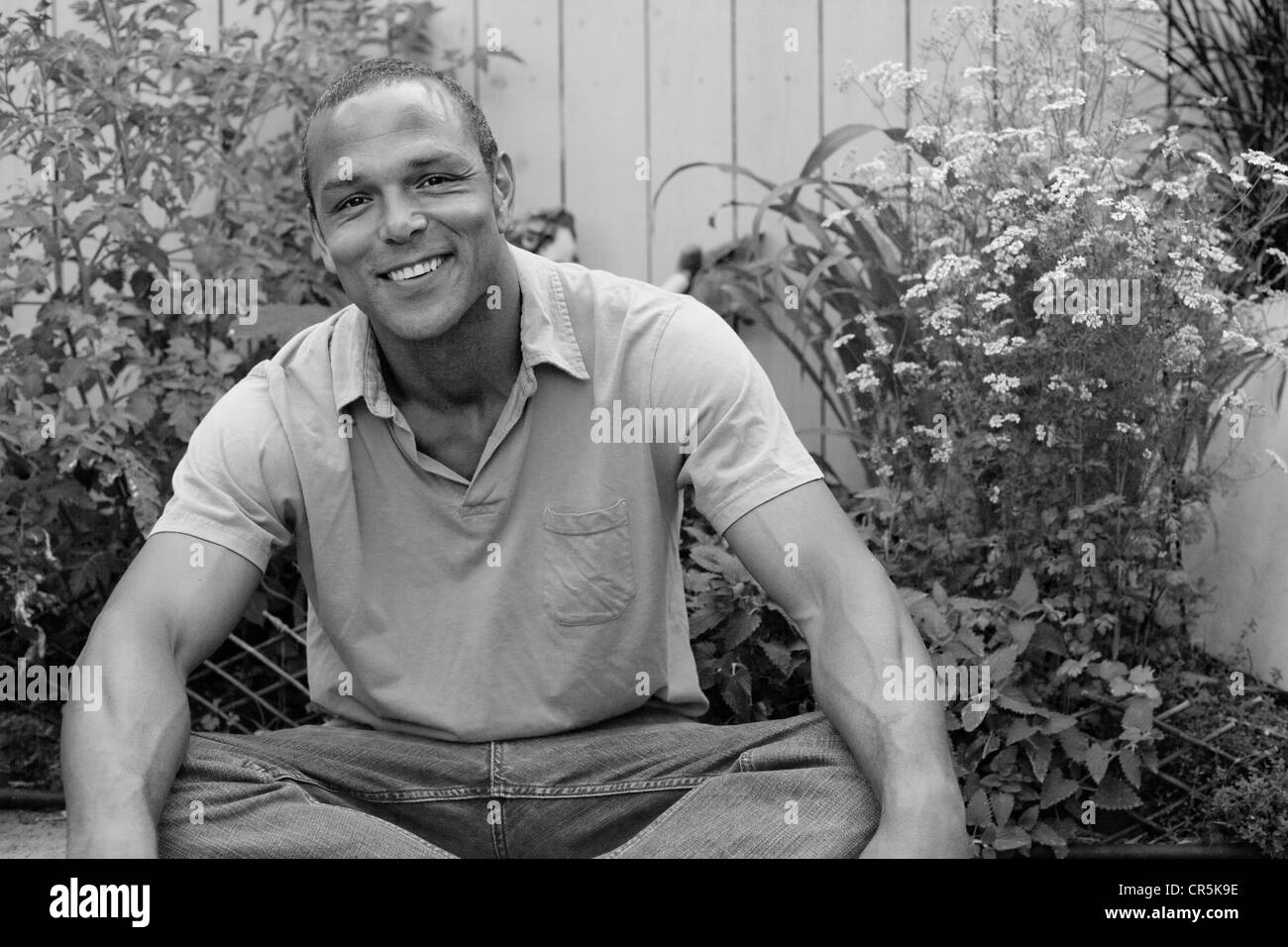 A man relaxing in his garden Stock Photo - Alamy