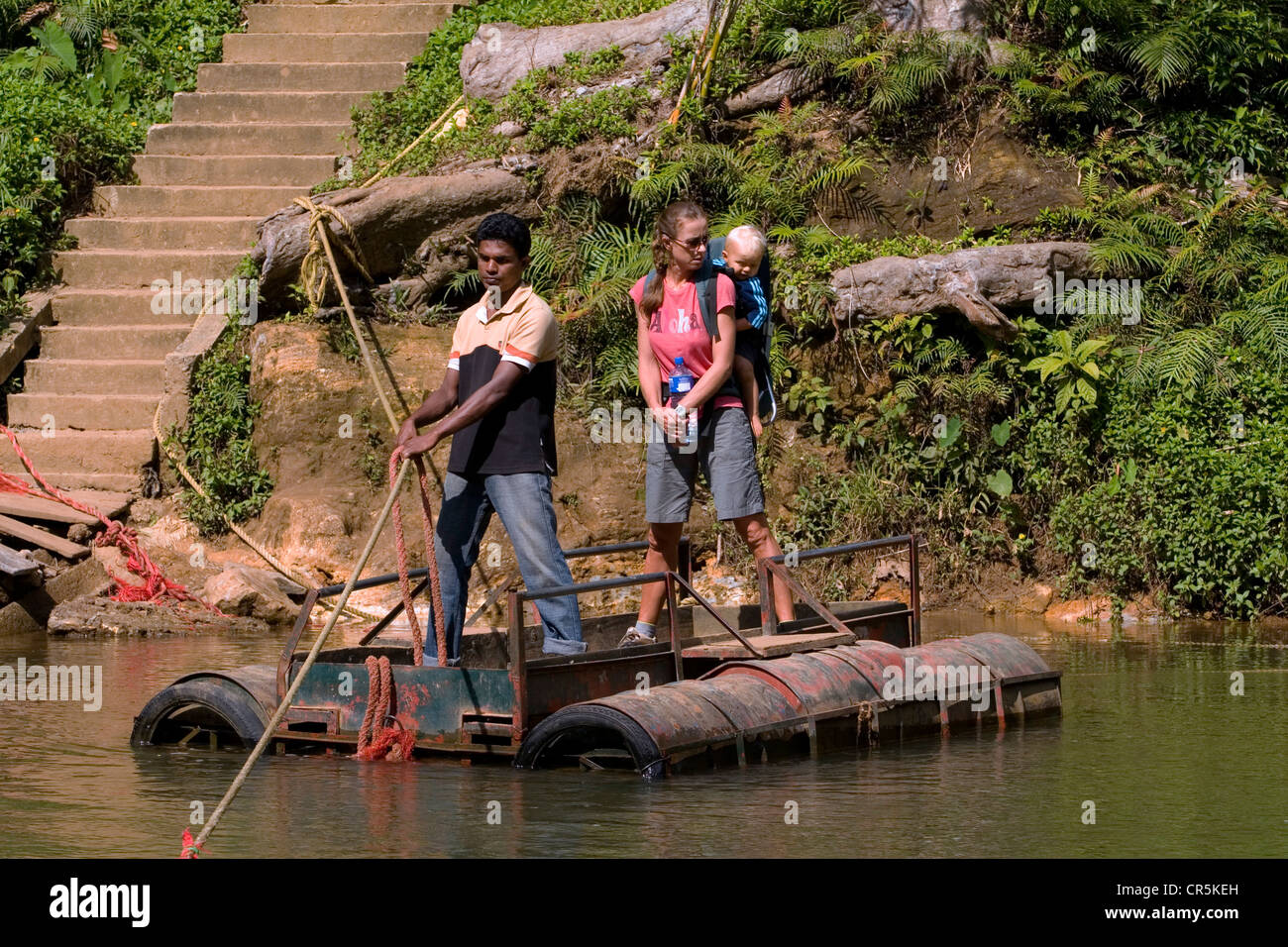 Hikers on a river barge to the Forestry Department camp by the Gin ...