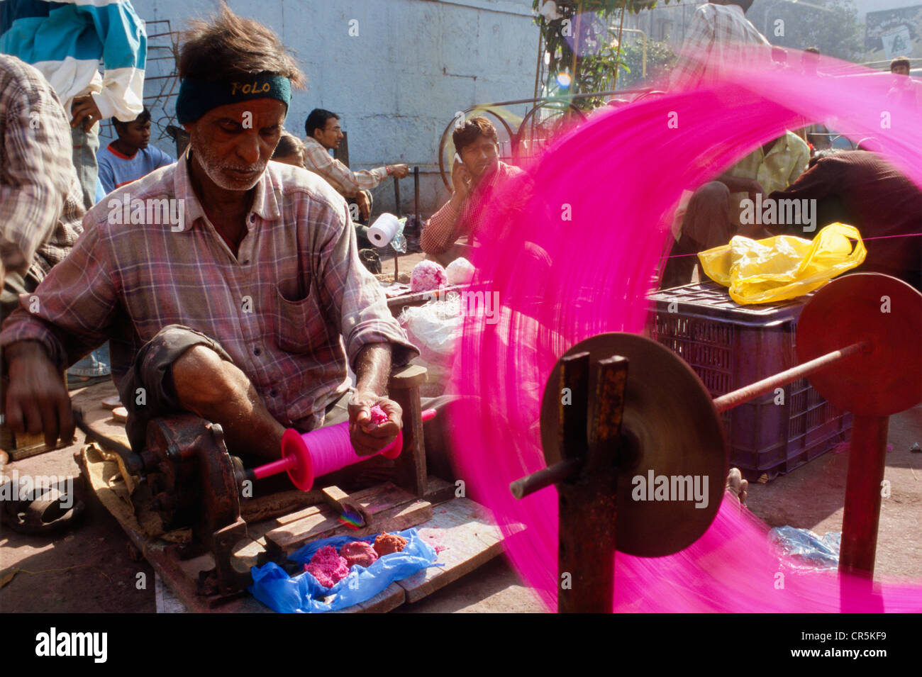 Preparing the kite threads with color and glass powder to cut the other ...