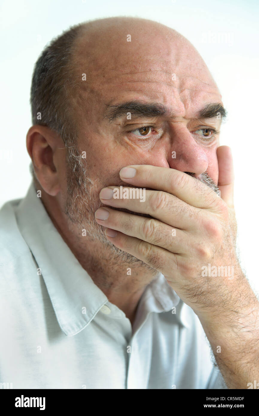 Senior man with a pensive look Stock Photo - Alamy
