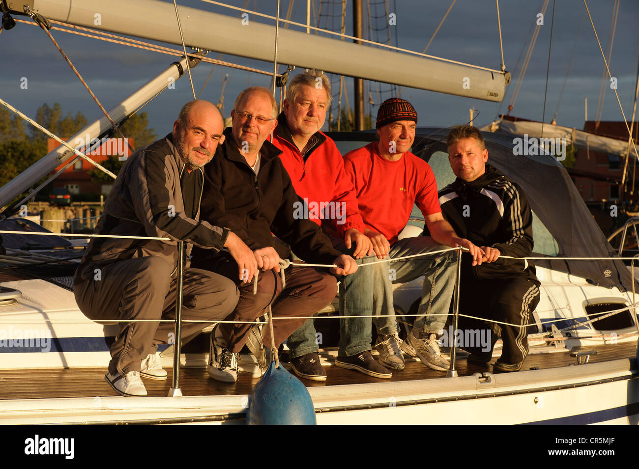 Crew of a sailing yacht on the upper deck in the morning sun Stock ...