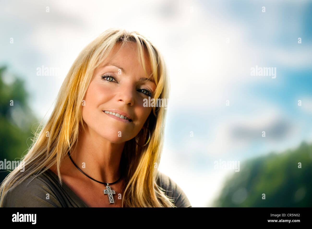 Woman in the sunshine, portrait Stock Photo - Alamy