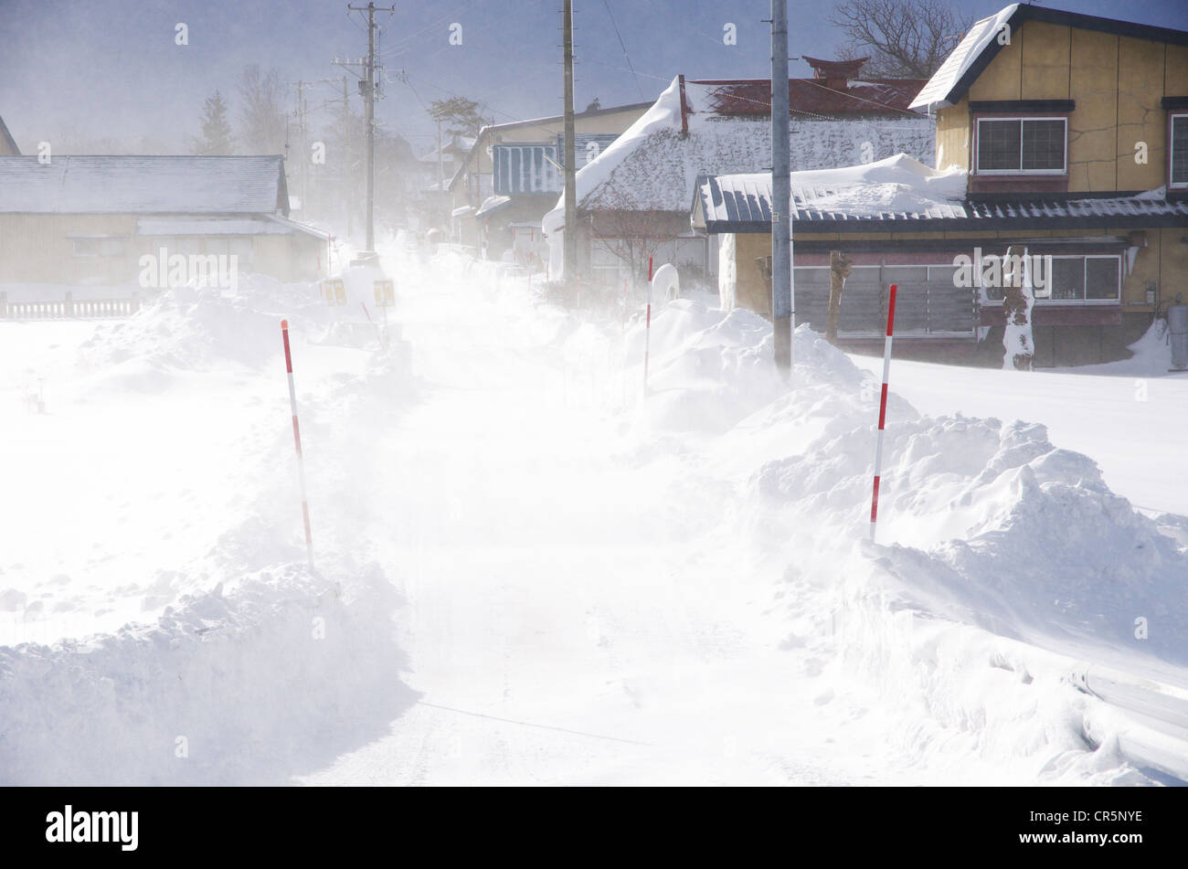 Snow Drifting Over Road Stock Photo - Alamy