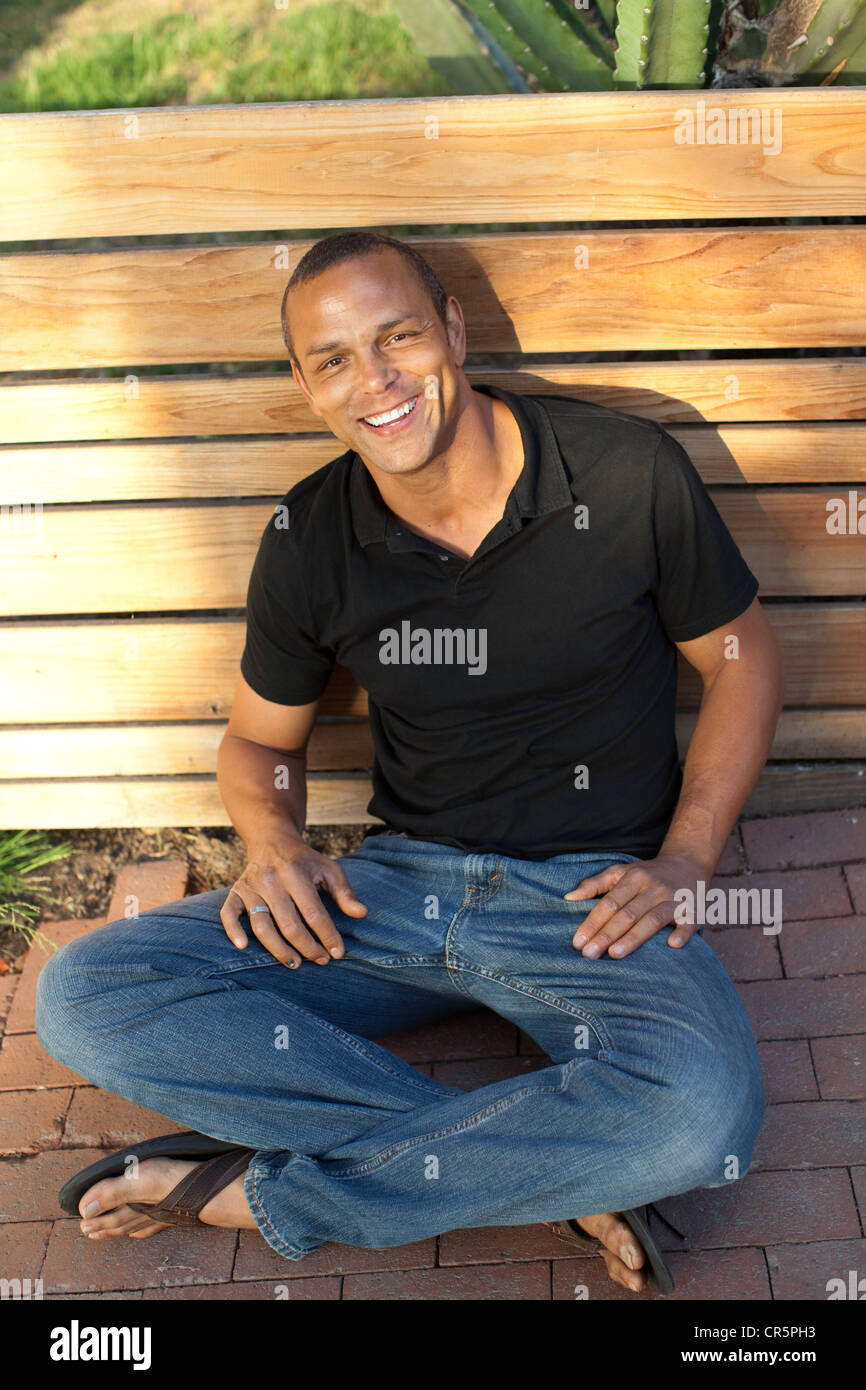 Man sitting cross legged Stock Photo - Alamy