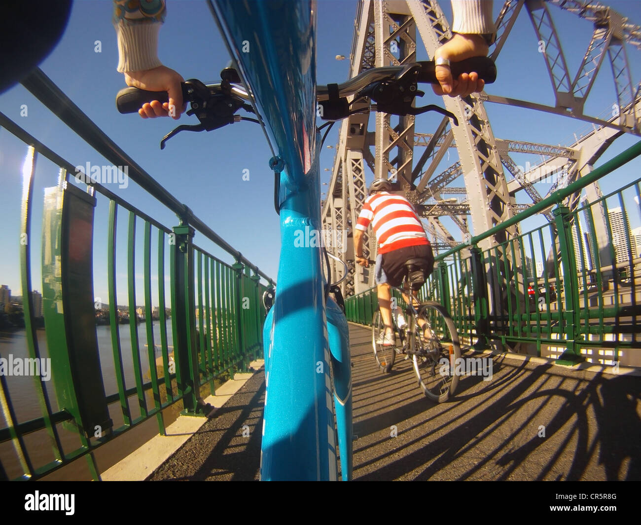 Cyclists crossing Story Bridge over Brisbane River towards Kangaroo ...