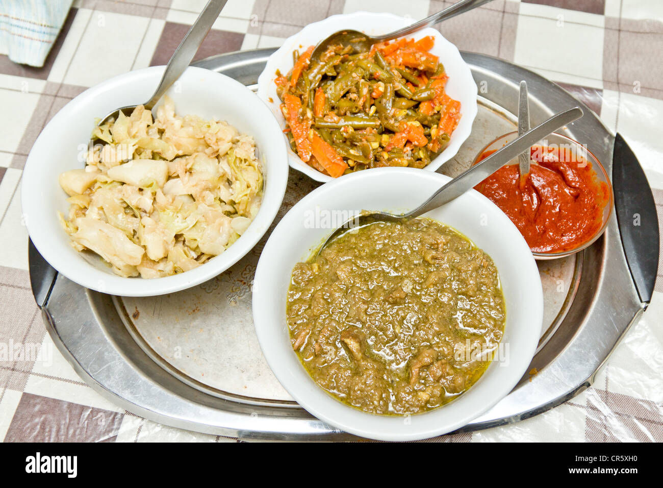 Different kinds of traditional Ethiopian wot (stew) served in a bowl ...