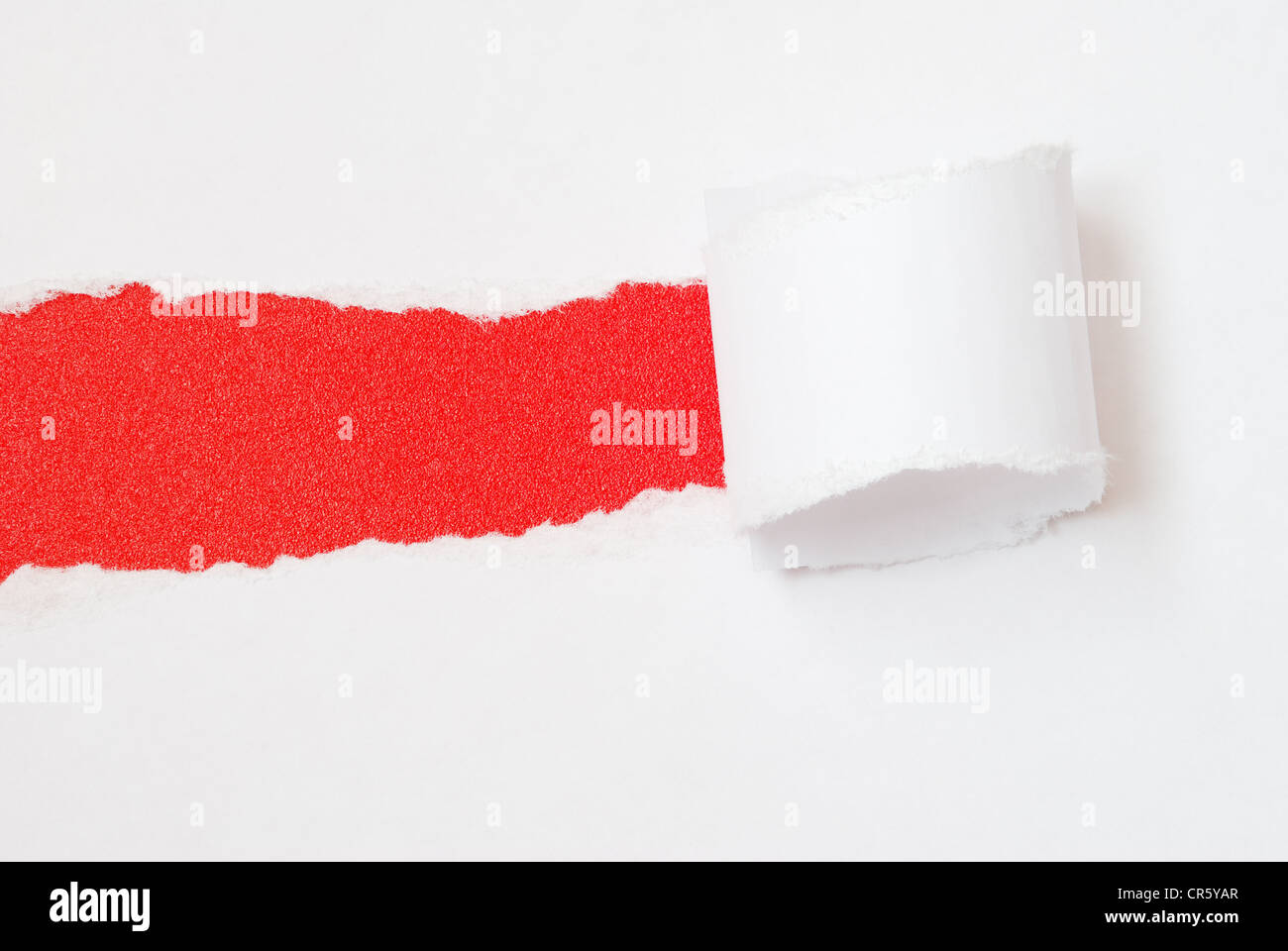 Ripped paper on red background Stock Photo - Alamy
