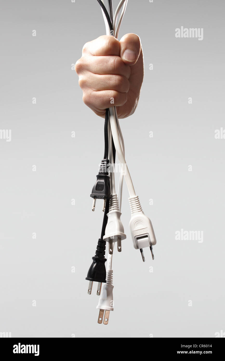 Hand Holding Plugs Stock Photo - Alamy