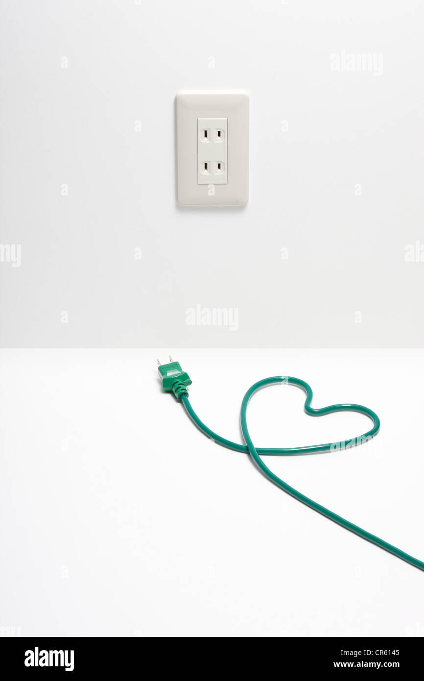 Green Plug In Heart Shape Stock Photo - Alamy