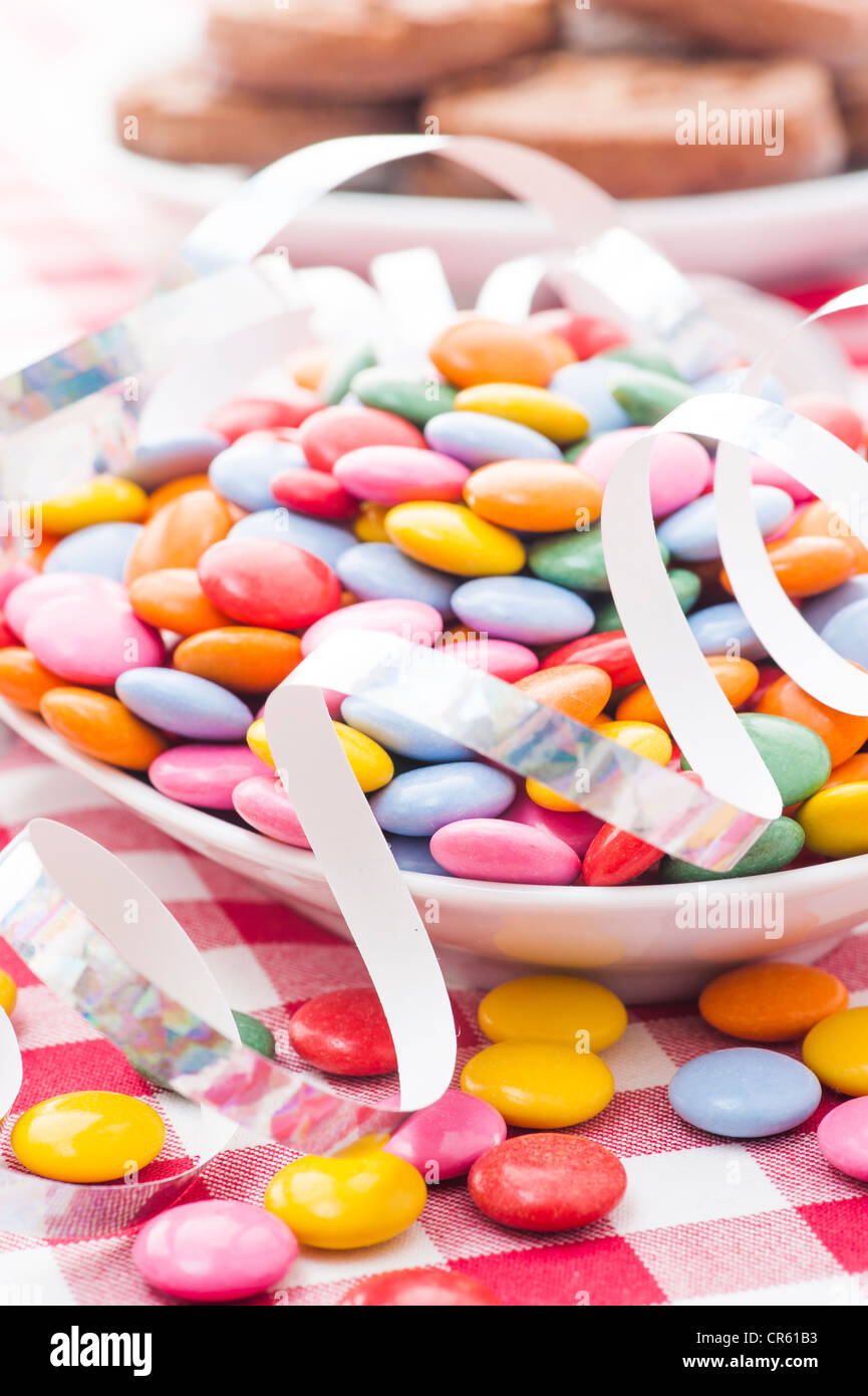 Close up of multicolored candy with streamer Stock Photo - Alamy