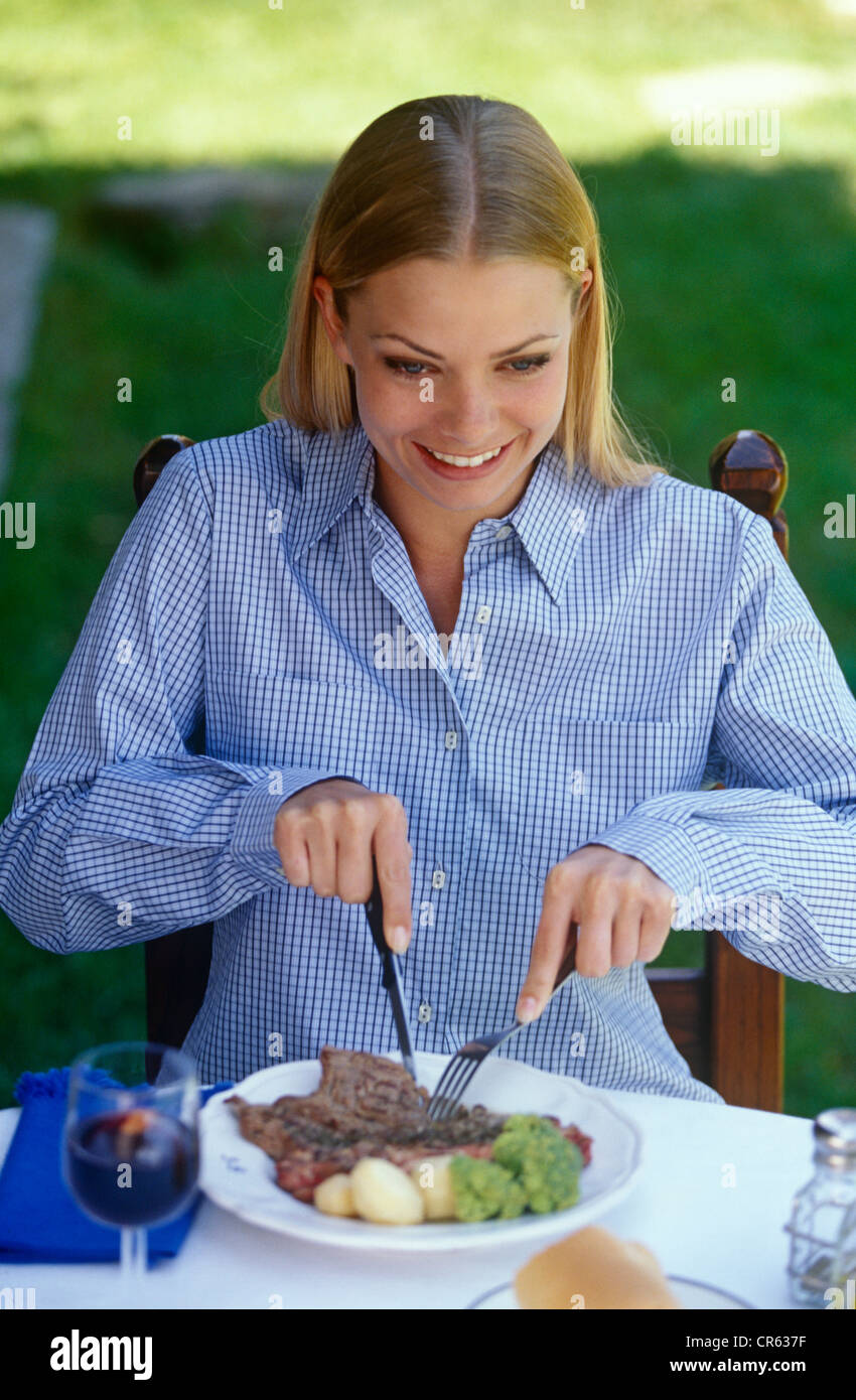 Young woman lady having lunch outdoors Stock Photo - Alamy