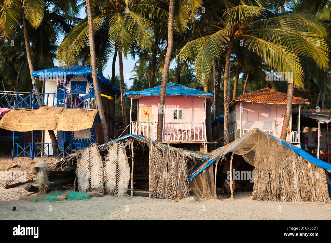 India, Goa State, Palolem, bungalow under coconut trees on the seaside ...