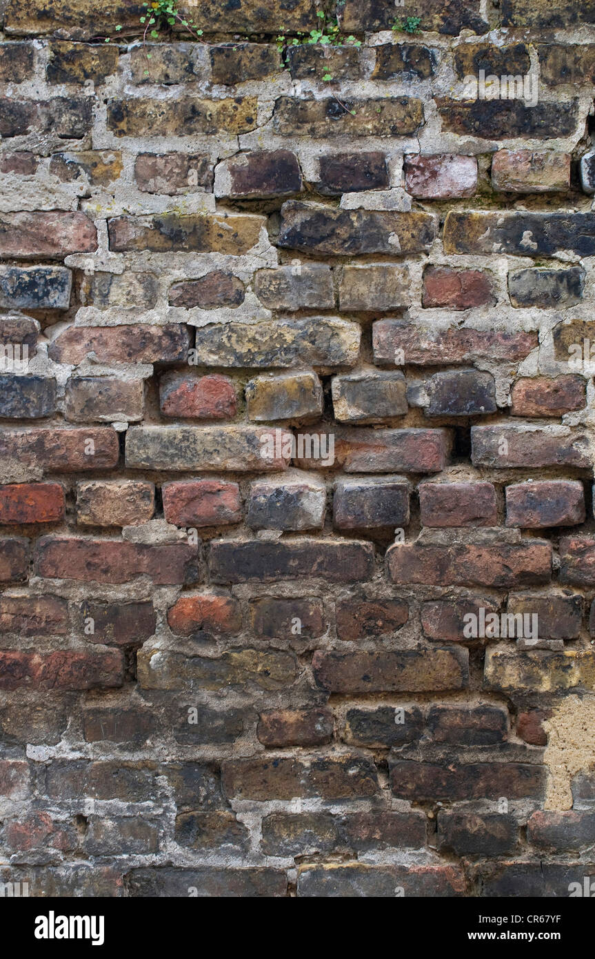 Old brick wall with defects Stock Photo - Alamy