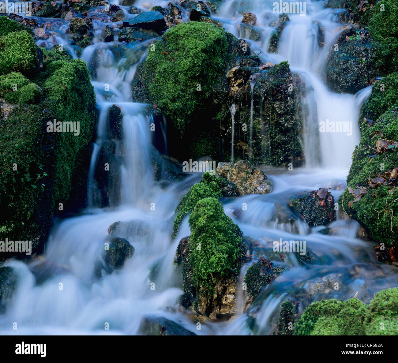 Stream flowing into rocks hi-res stock photography and images - Alamy