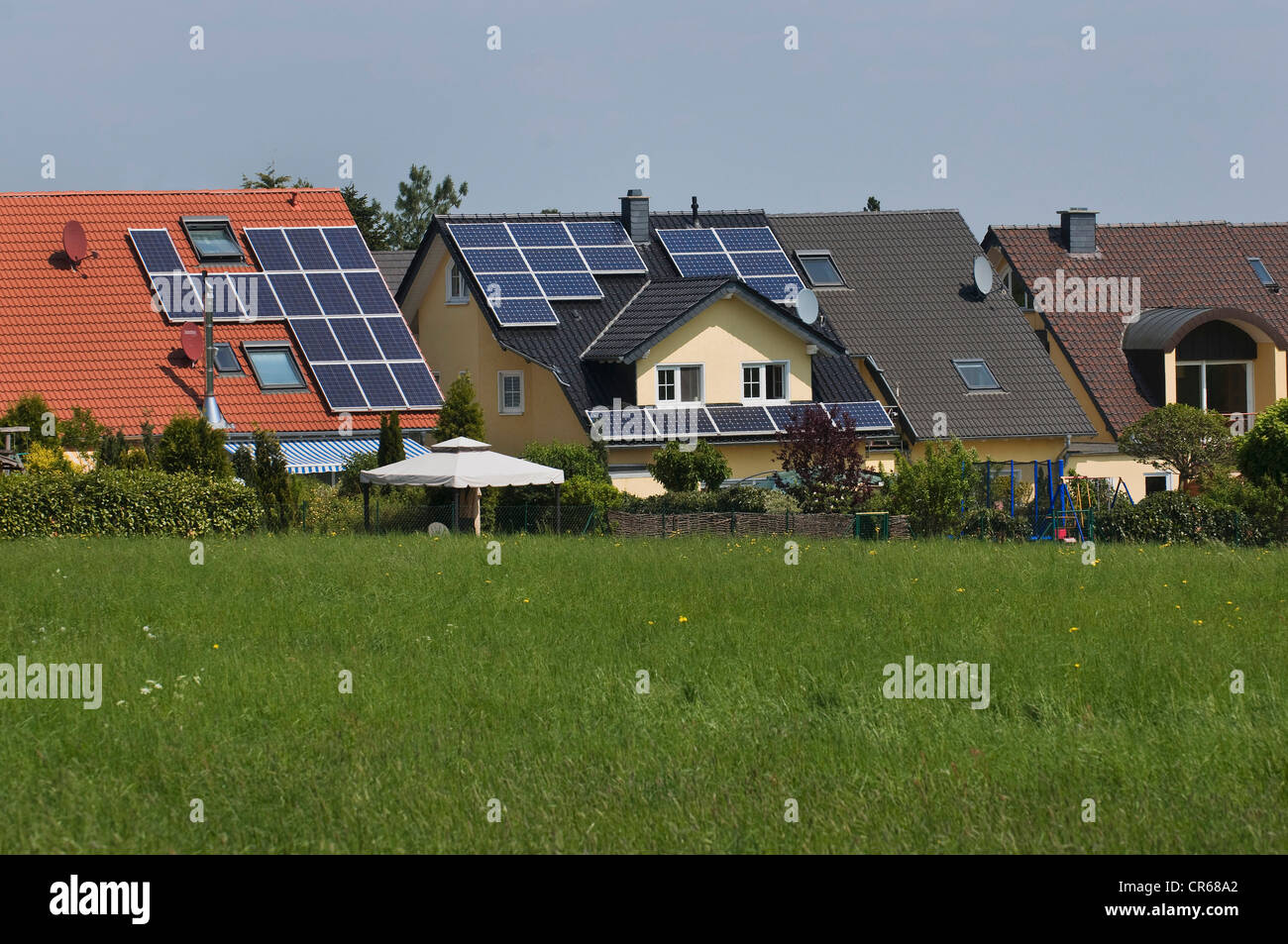 Modern housing estate, multi-family houses with solar panels on the ...