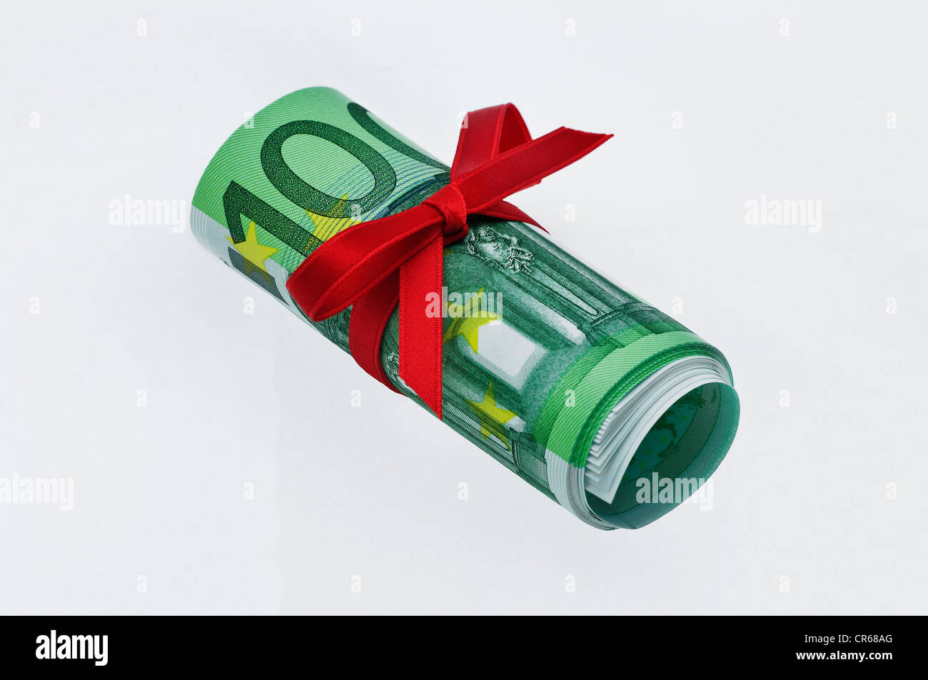 Rolled up 100-euro banknotes with a red ribbon, gift of money Stock ...