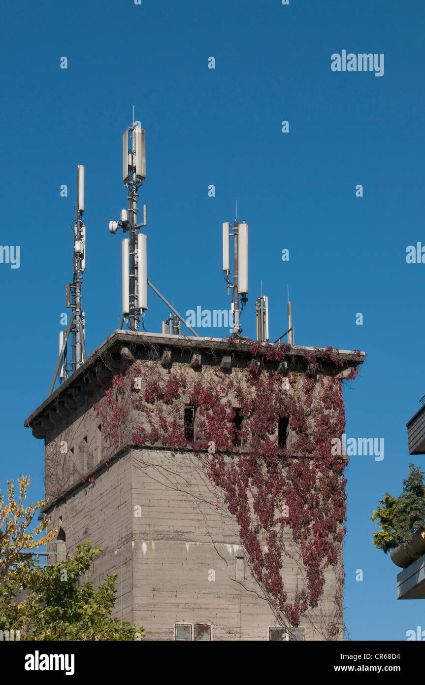 Several mobile phone antennas on the tower of a bunker, PublicGround ...