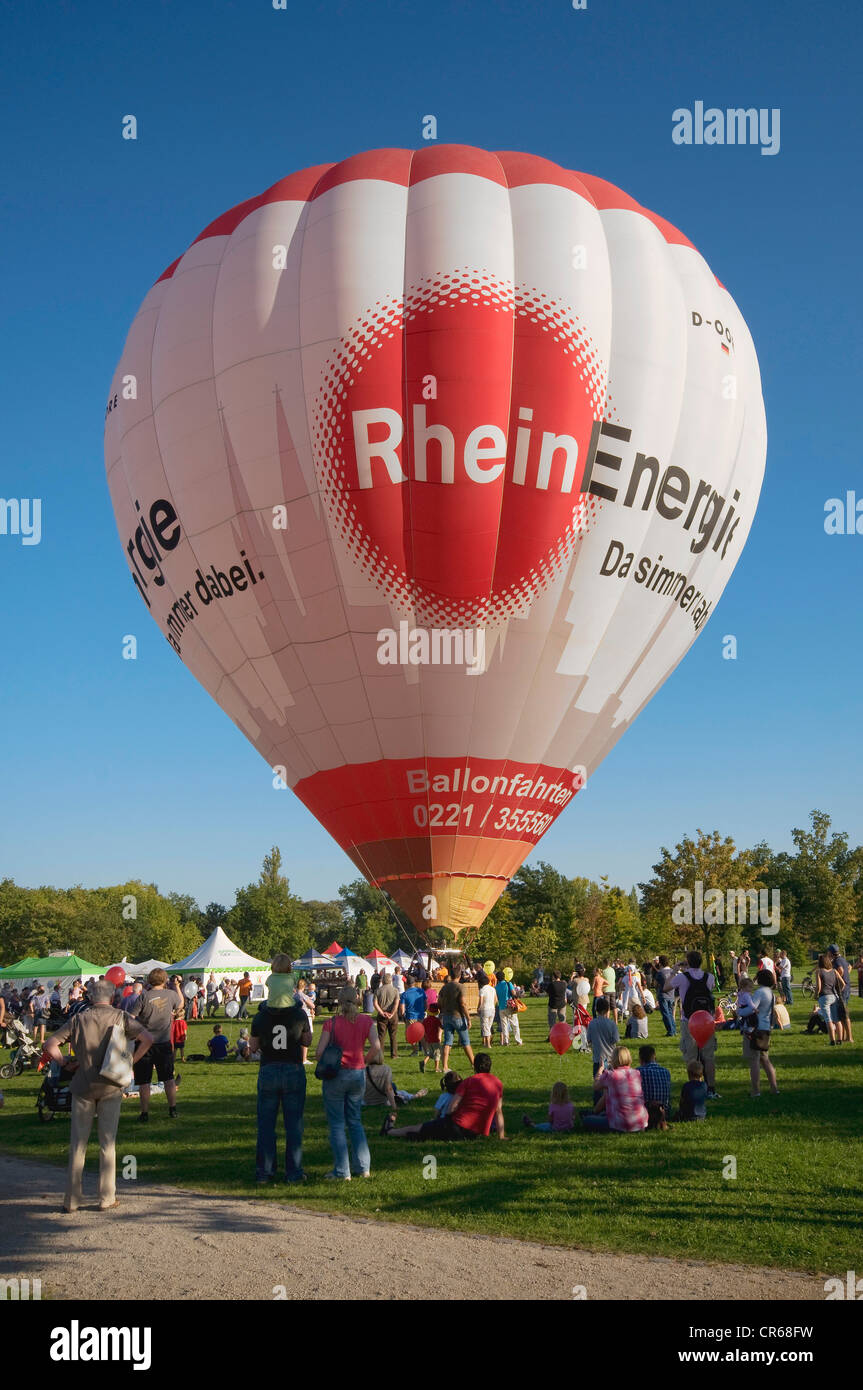 Moored balloon with a Rheinenergie logo before take-off, spectators ...