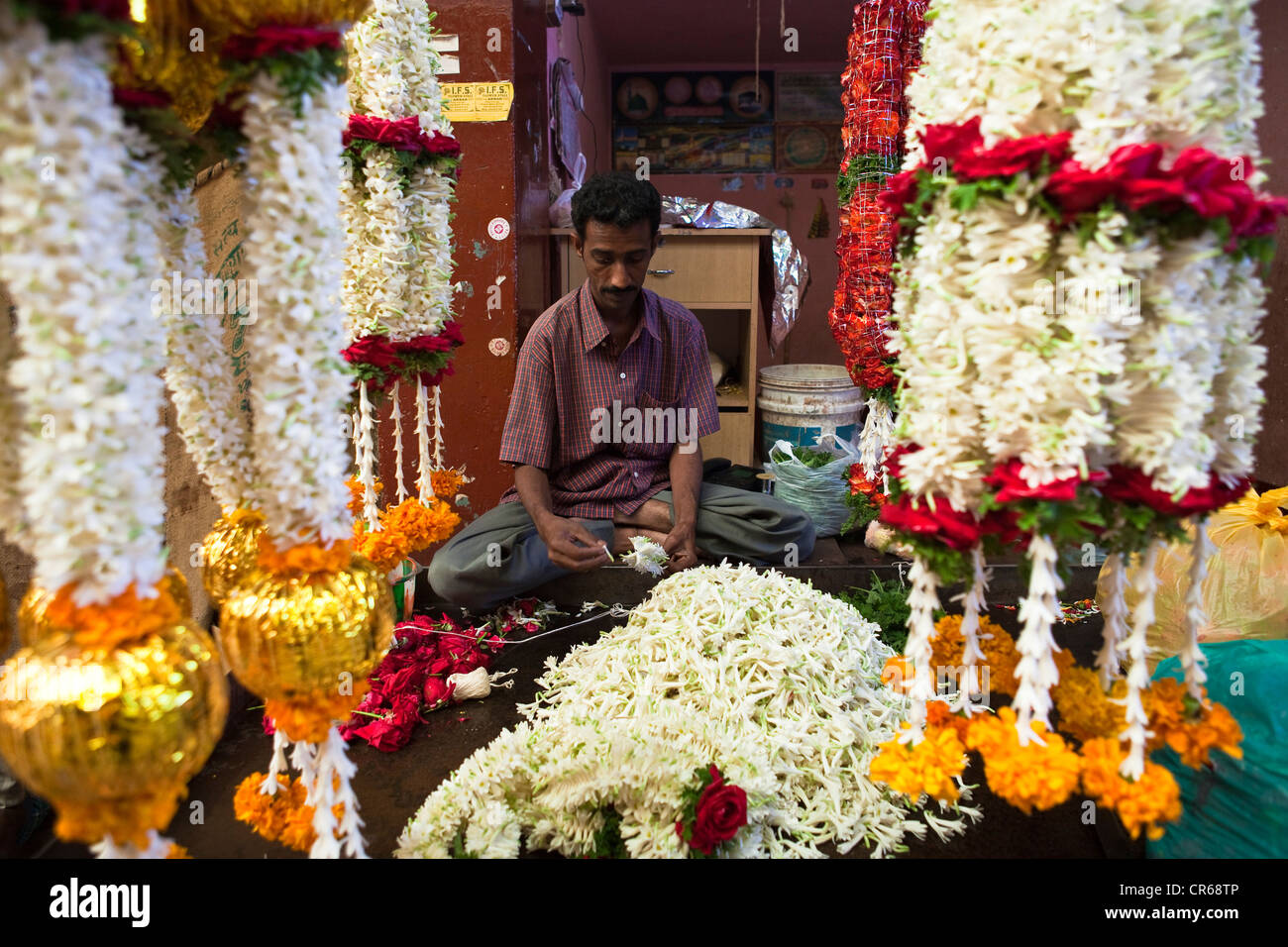 India, Karnataka State, Mysore, making flowers for ceremonies Stock ...