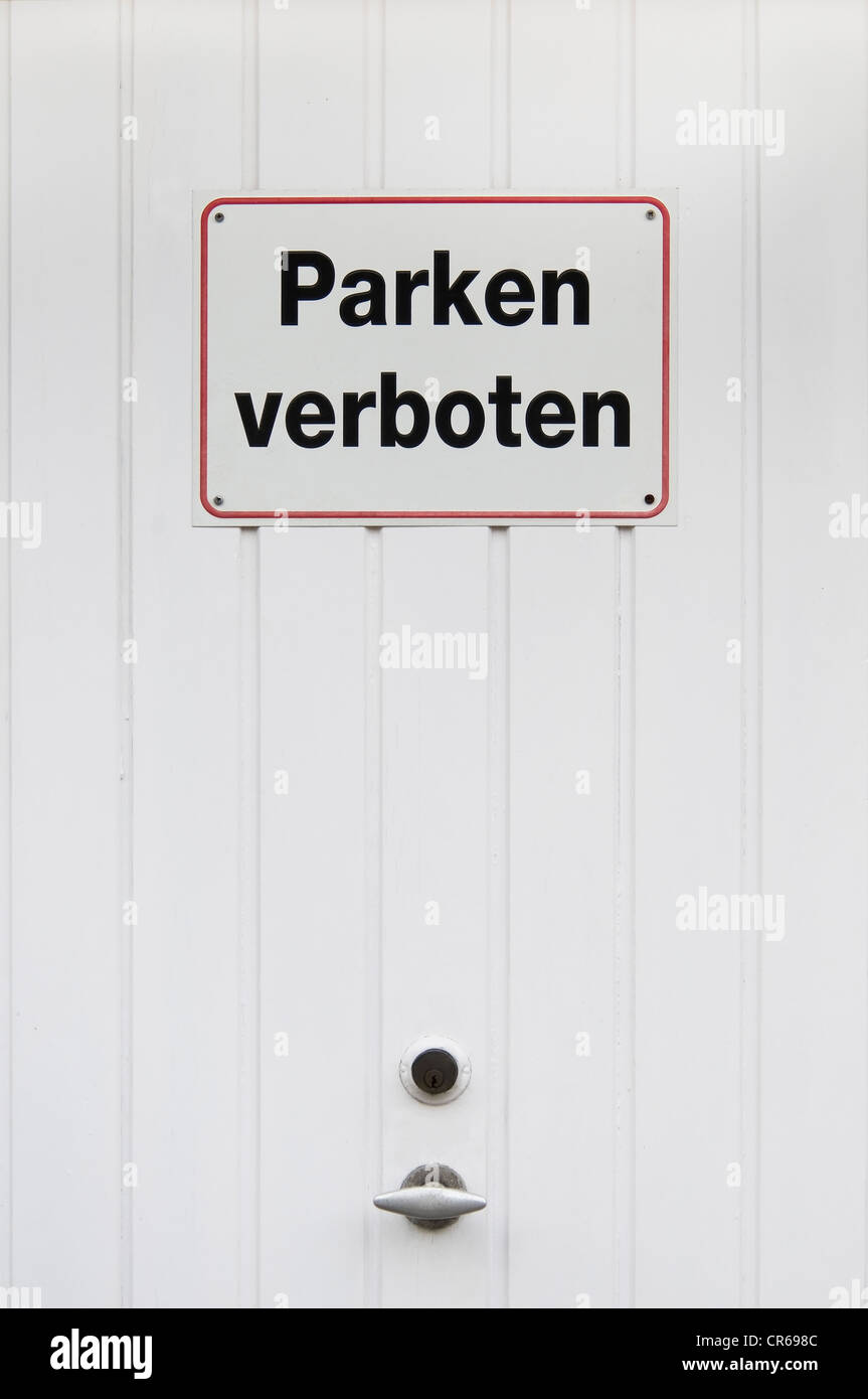 Sign on a garage door, "Parken verboten", German for "no parking Stock ...
