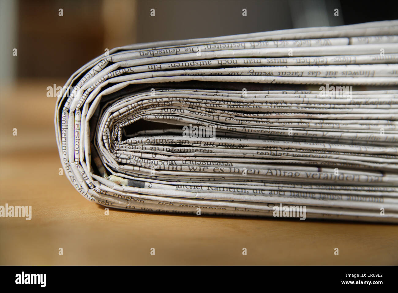 Germany, Bundle of newspapers on table Stock Photo - Alamy