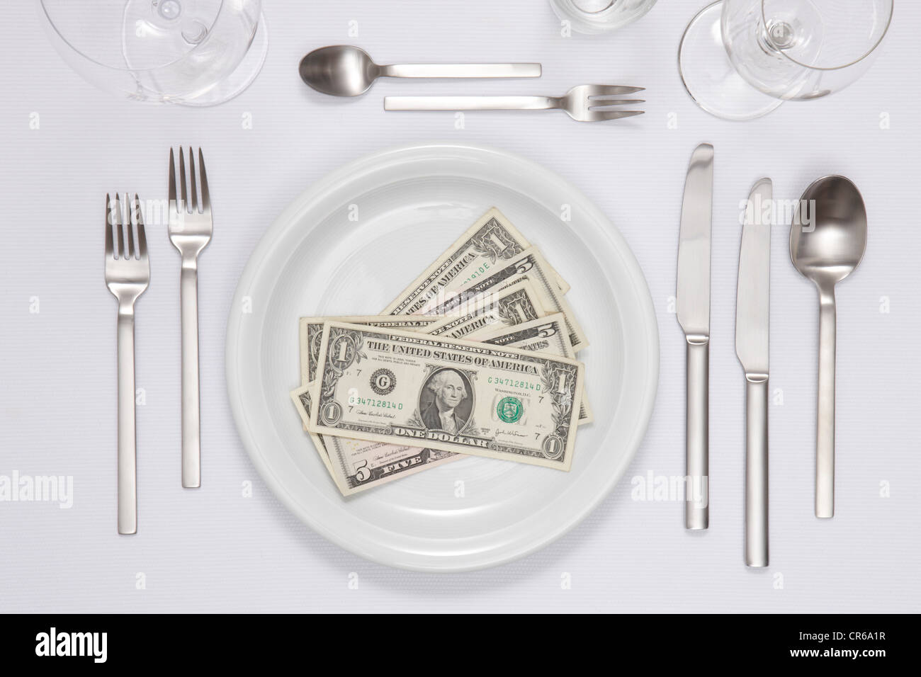 1 dollars in plate Stock Photo - Alamy