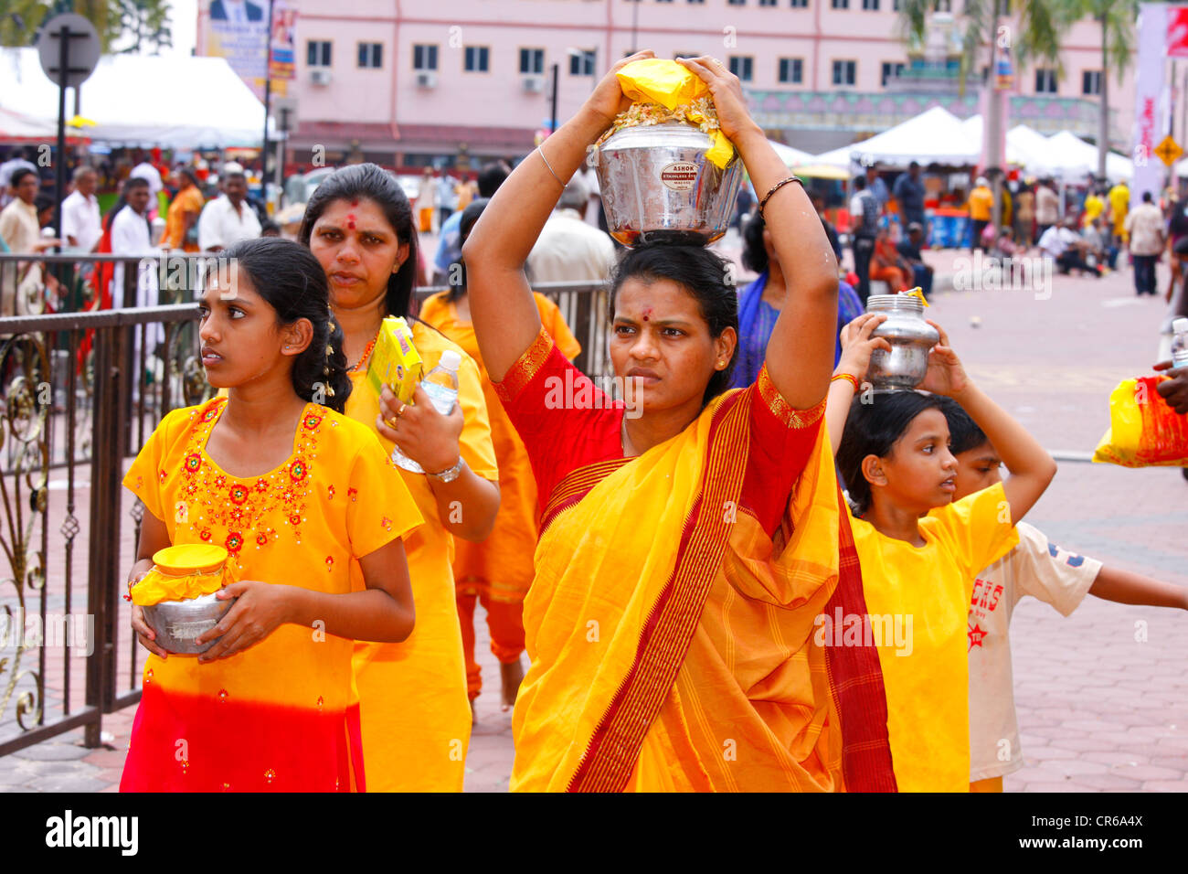 Pilgrims making a milk sacrifice, Hindu festival Thaipusam, Batu Caves ...