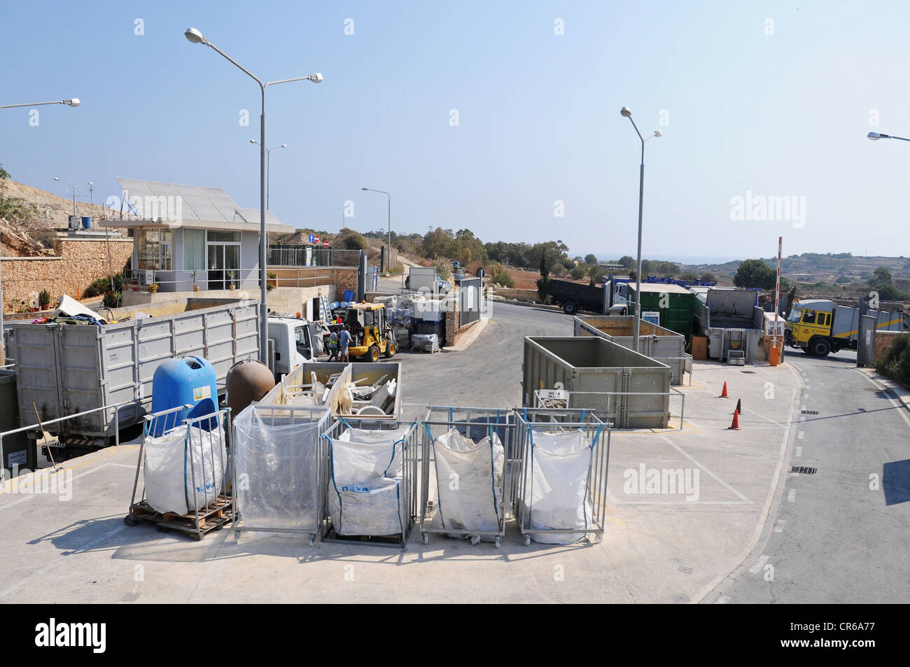 A civic amenity site where different recyclable materials are separated ...