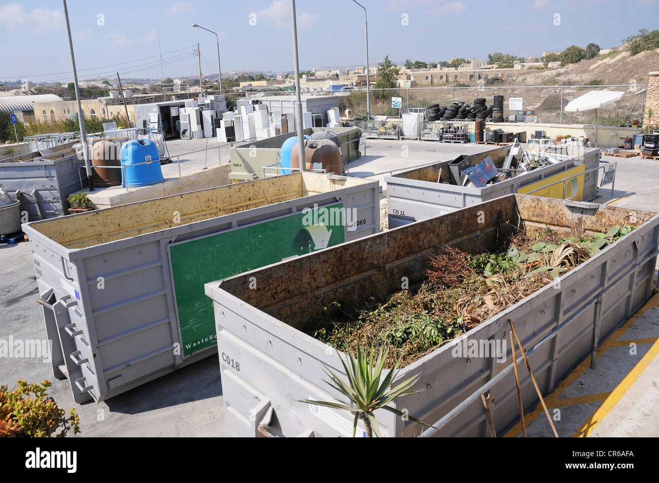 A civic amenity site where different recyclable materials are separated ...