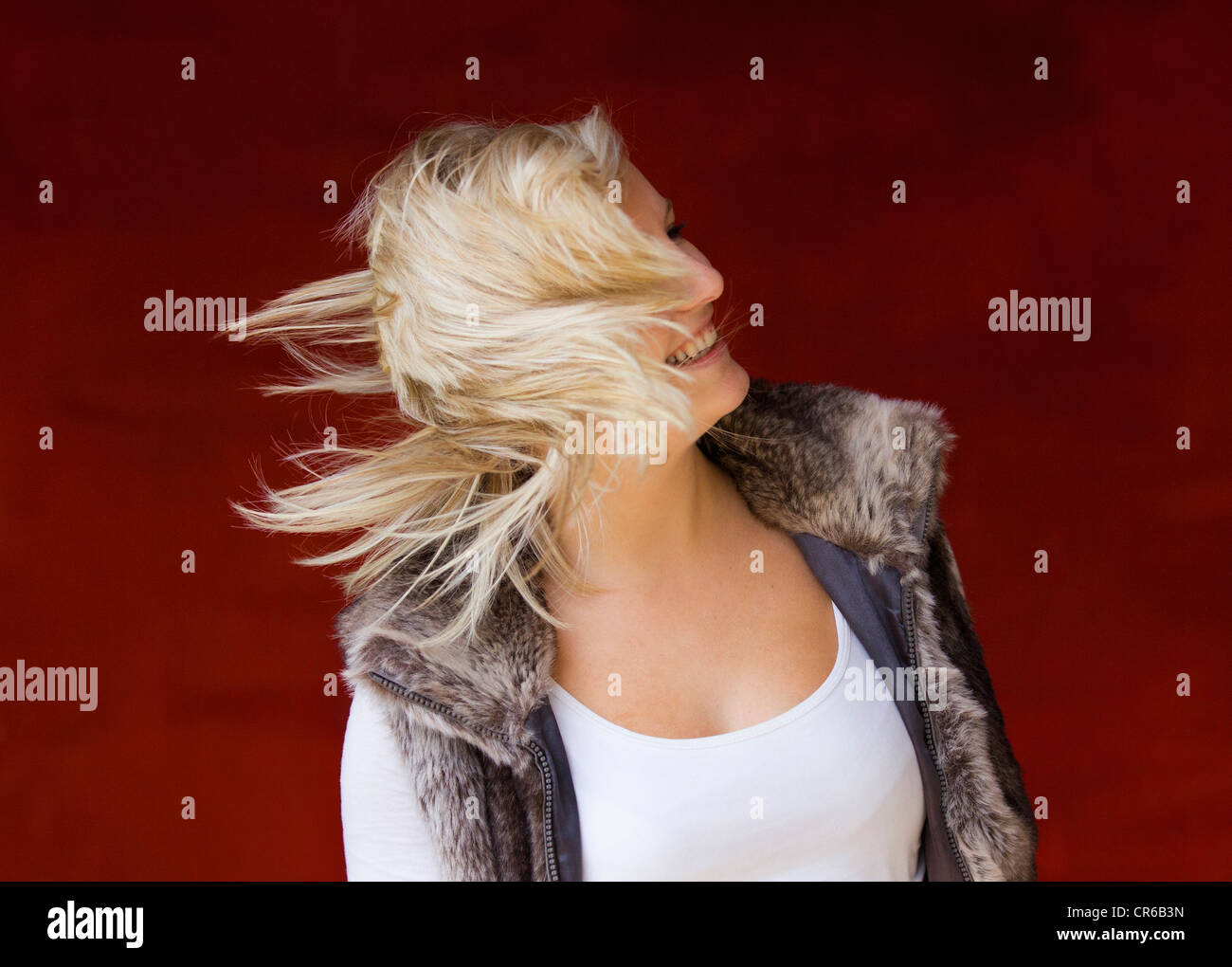 Woman shaking hair red hi-res stock photography and images - Alamy