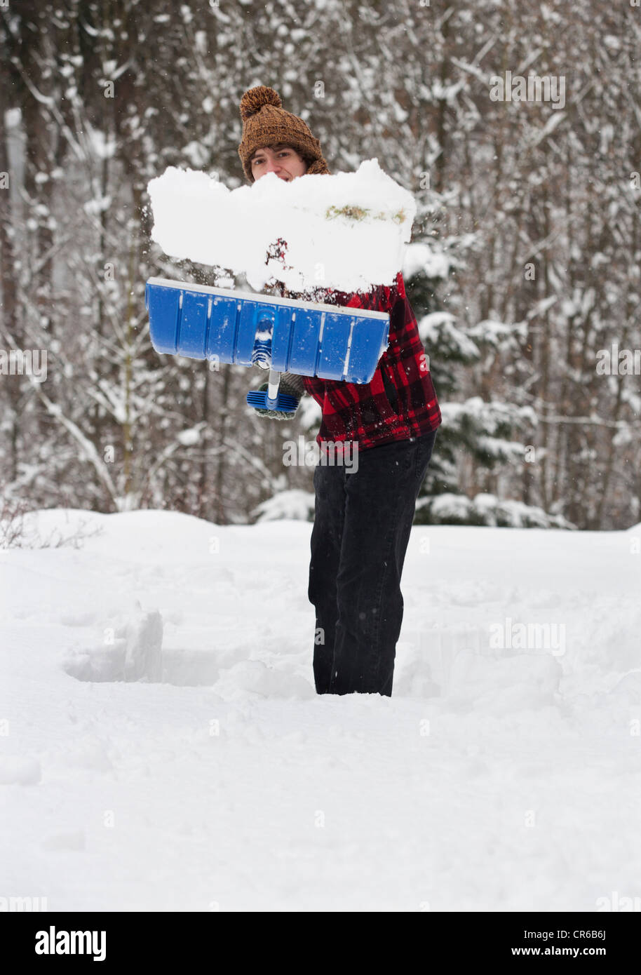 Man shoveling hi-res stock photography and images - Alamy