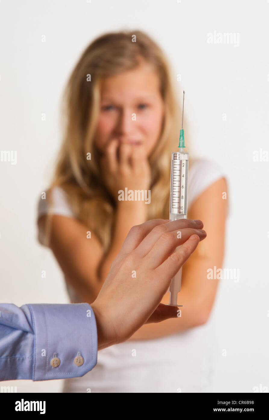 Woman holding syringe in mouth hi-res stock photography and images - Alamy