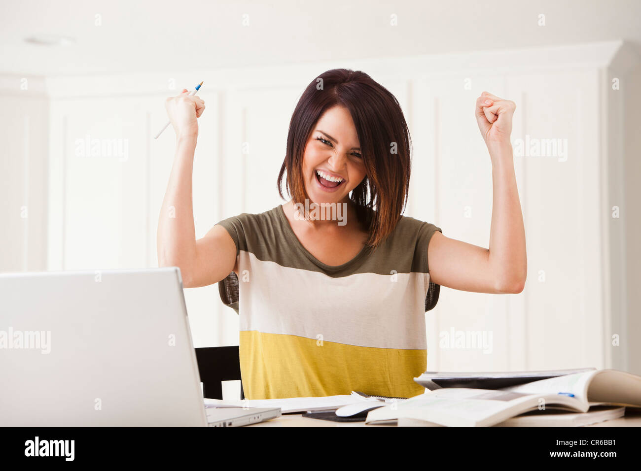 Portrait of young woman learning at home Stock Photo - Alamy