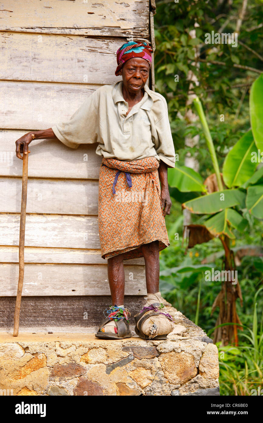 Leprous woman outside her house, tuberculosis and leprosy station ...