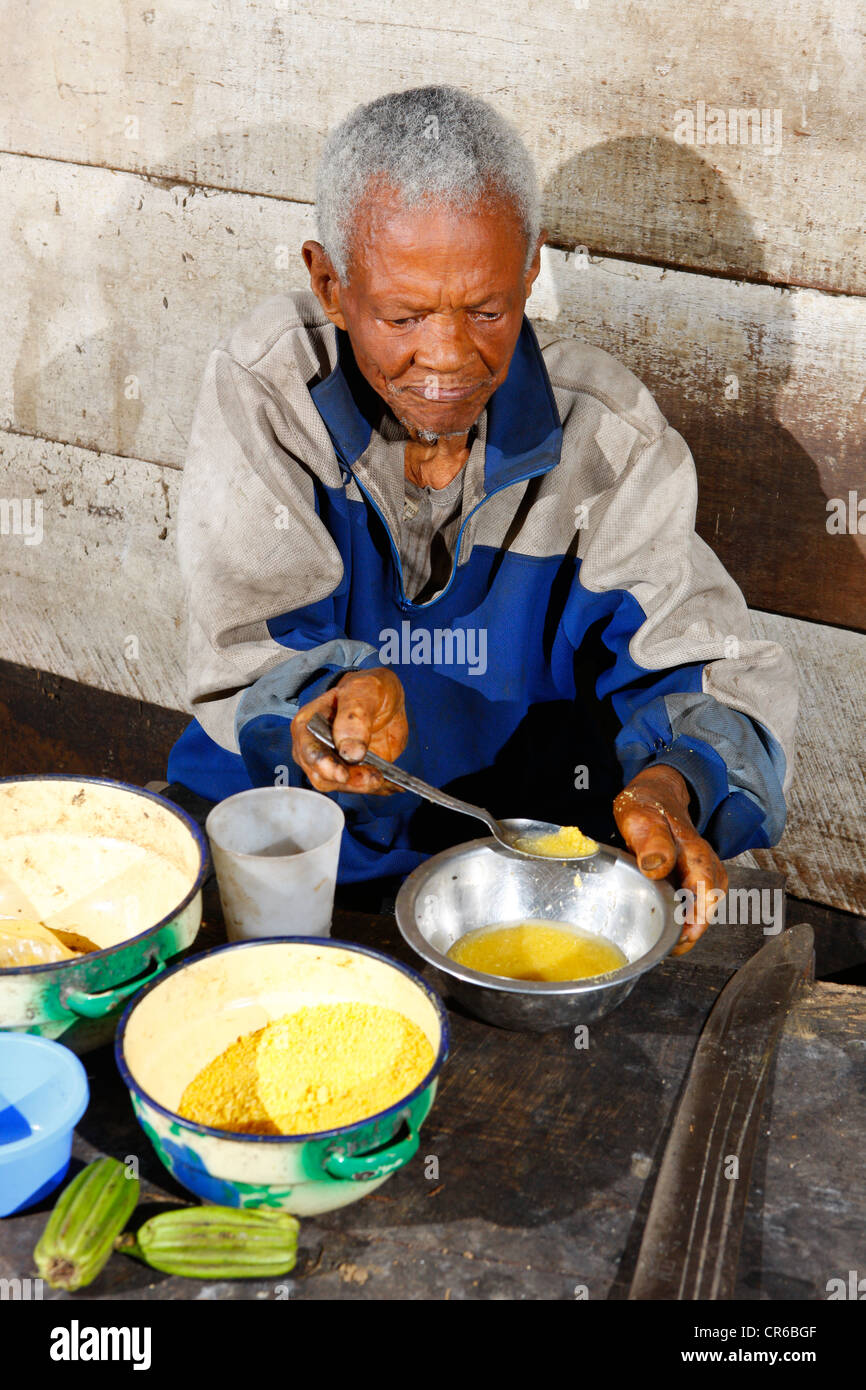 Leper eating food, TB and leprosy settlement, Manyemen, Cameroon ...