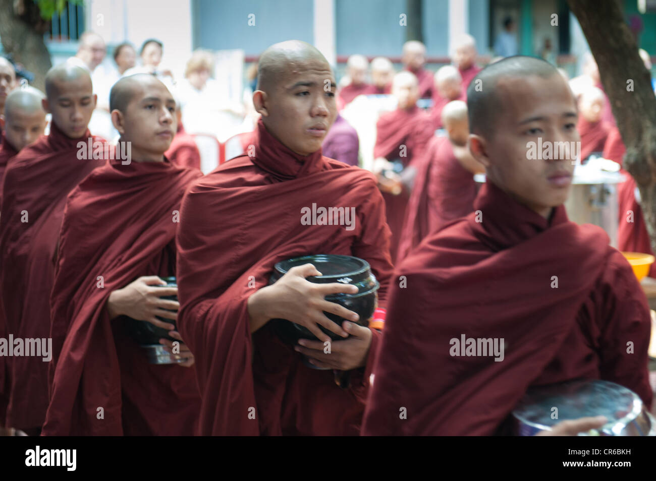 Monks Queue for Meal Stock Photo - Alamy