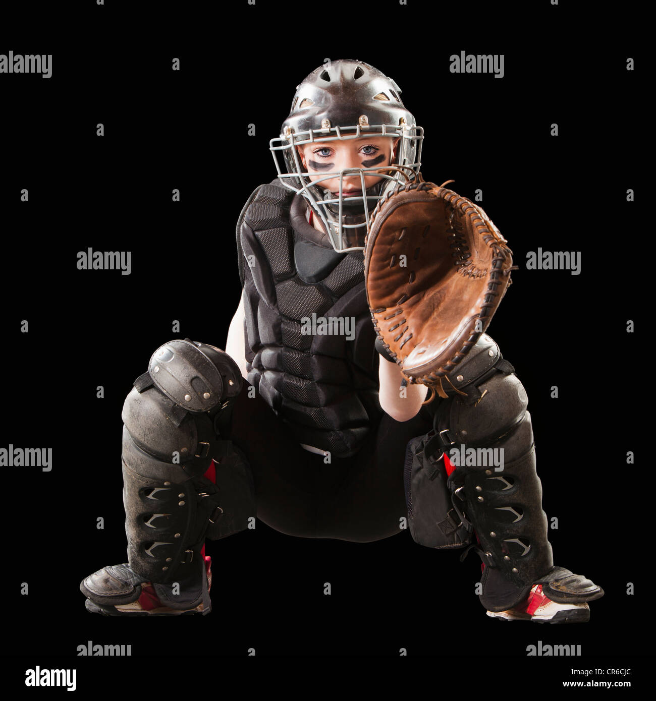 Girl (12-13) plying softball, studio shot Stock Photo - Alamy