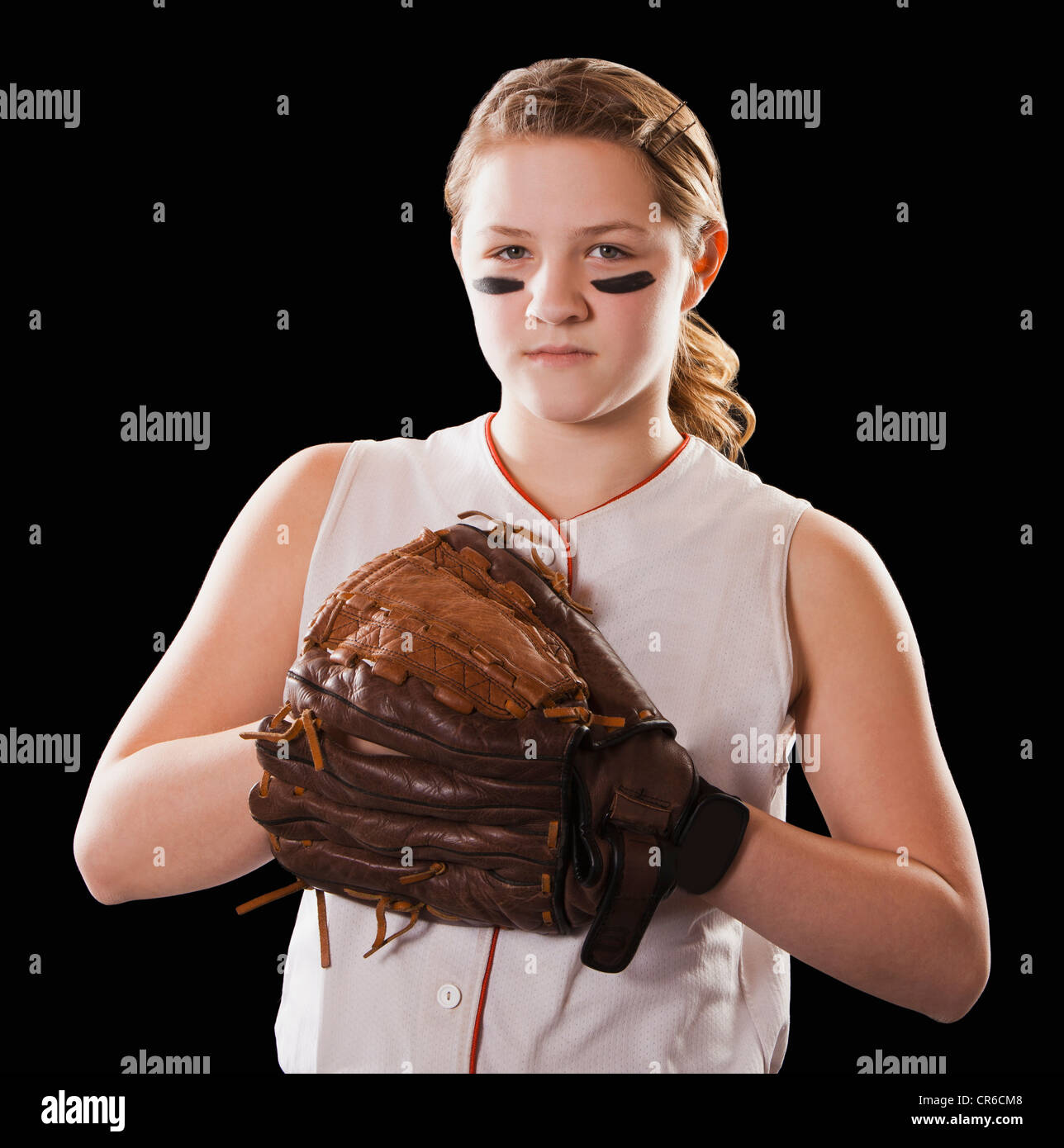 Portrait of girl (12-13) plying softball, studio shot Stock Photo - Alamy