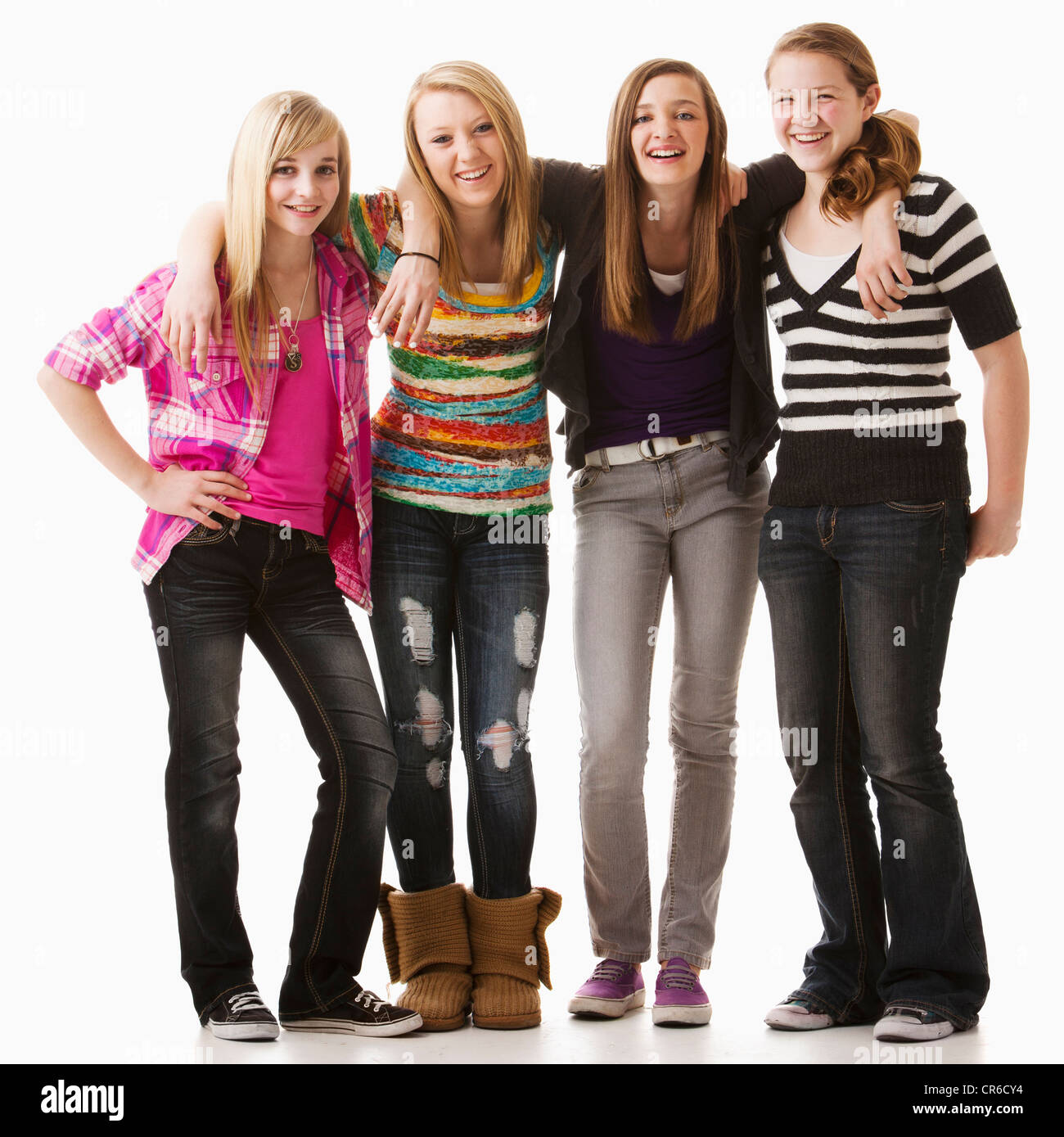 Studio shot of four happy girls (12-13 Stock Photo - Alamy