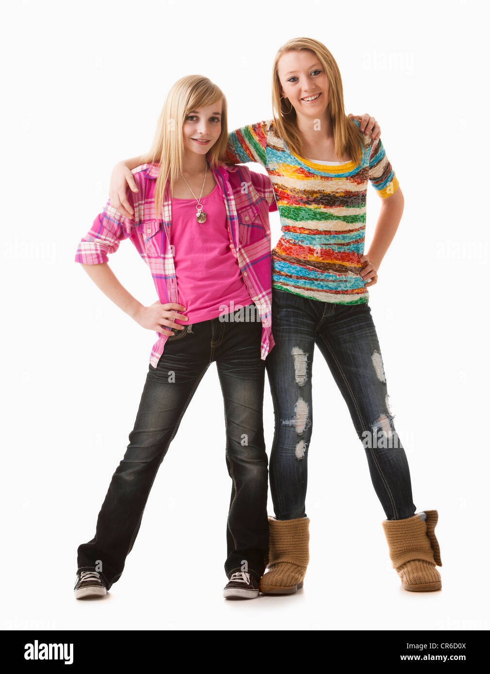 Studio shot of two happy girls (12-13 Stock Photo - Alamy