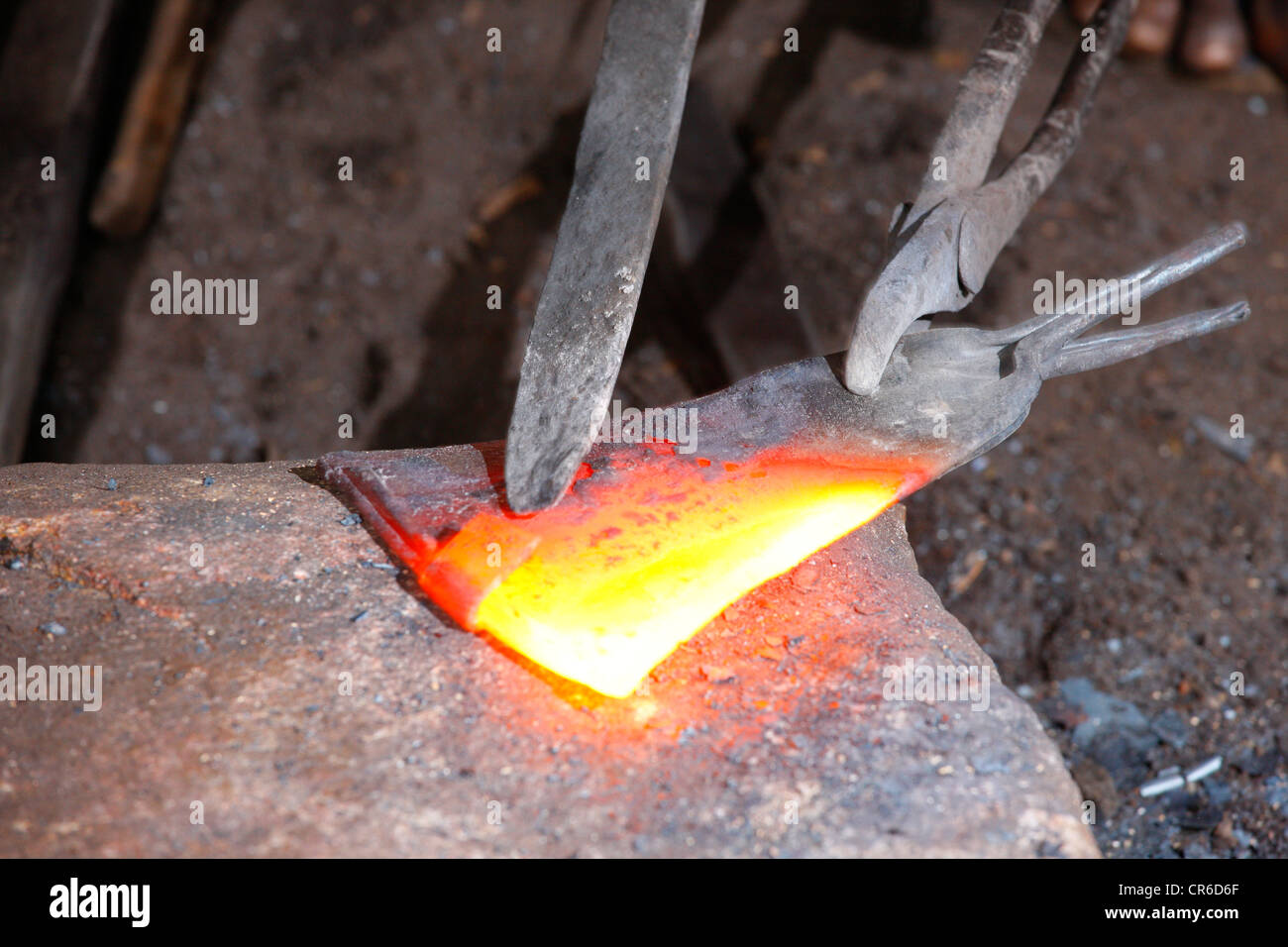 Red-hot scrap metal being forged, Babungo, Cameroon, Africa Stock Photo ...